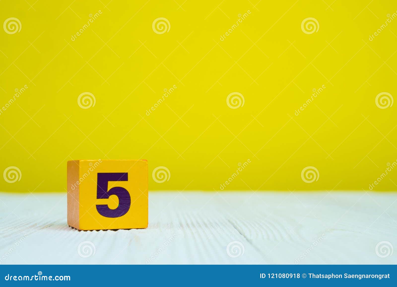 Square Block Puzzle Number 5 on Table with Yellow Background Stock ...