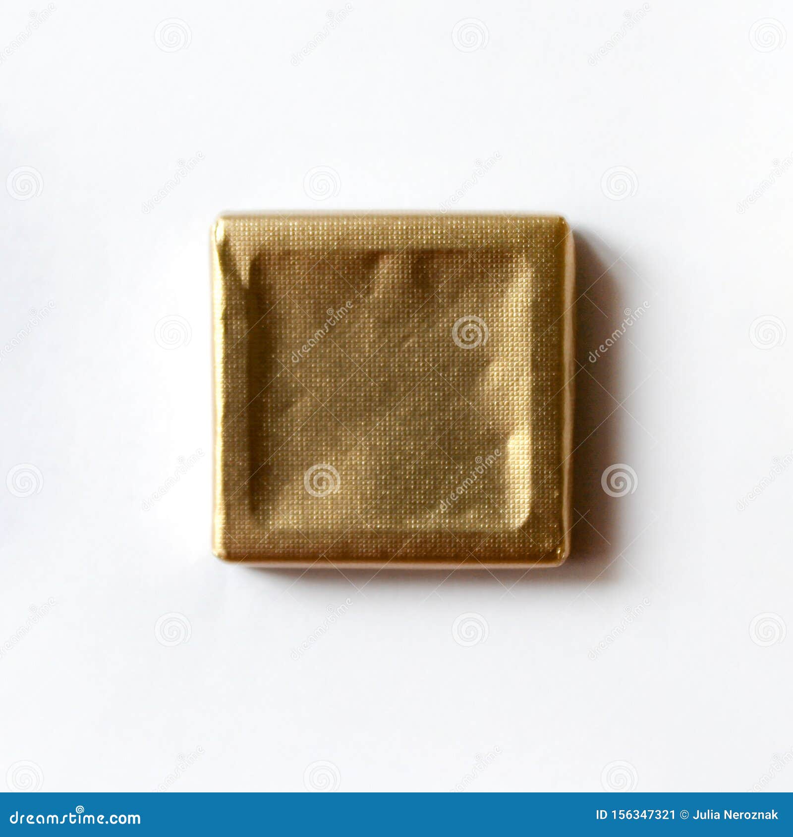 Square Chocolate Candy Wrapped in Golden Foil Isolated on White Surface ...