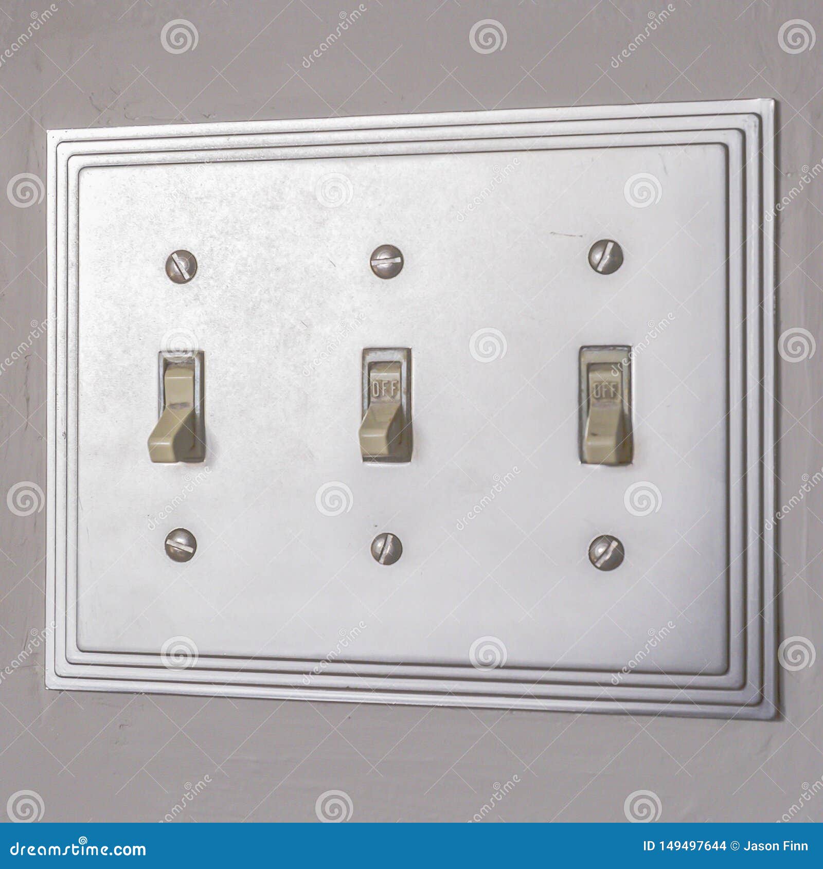 Square Close Up of the Electrical Light Switch Against the White Wall ...