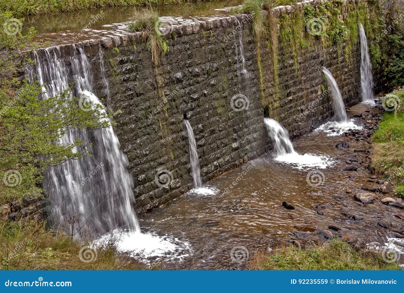 Square Concrete Blocks Dam on the River with Holes for Drain Water ...