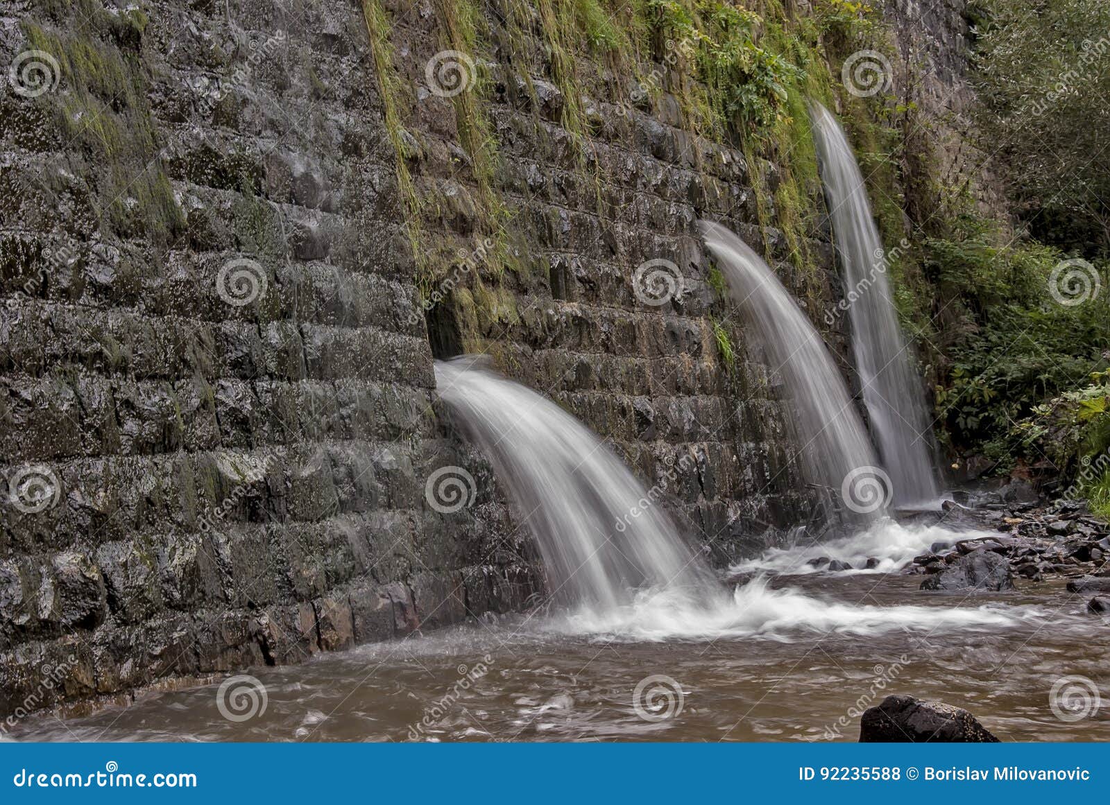Square Concrete Blocks Dam on the River with Holes for Drain Water ...