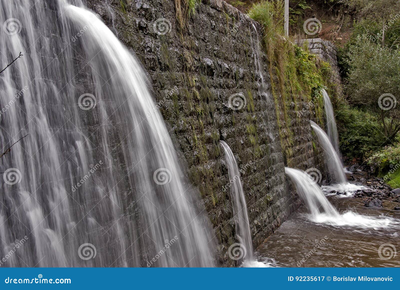 Square Concrete Blocks Dam on the River with Holes for Drain Water ...