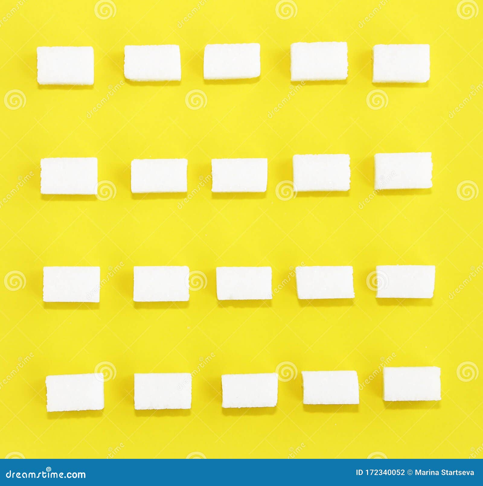 Square Cubes of Sweet White Refined Sugar on a Yellow Background Stock ...