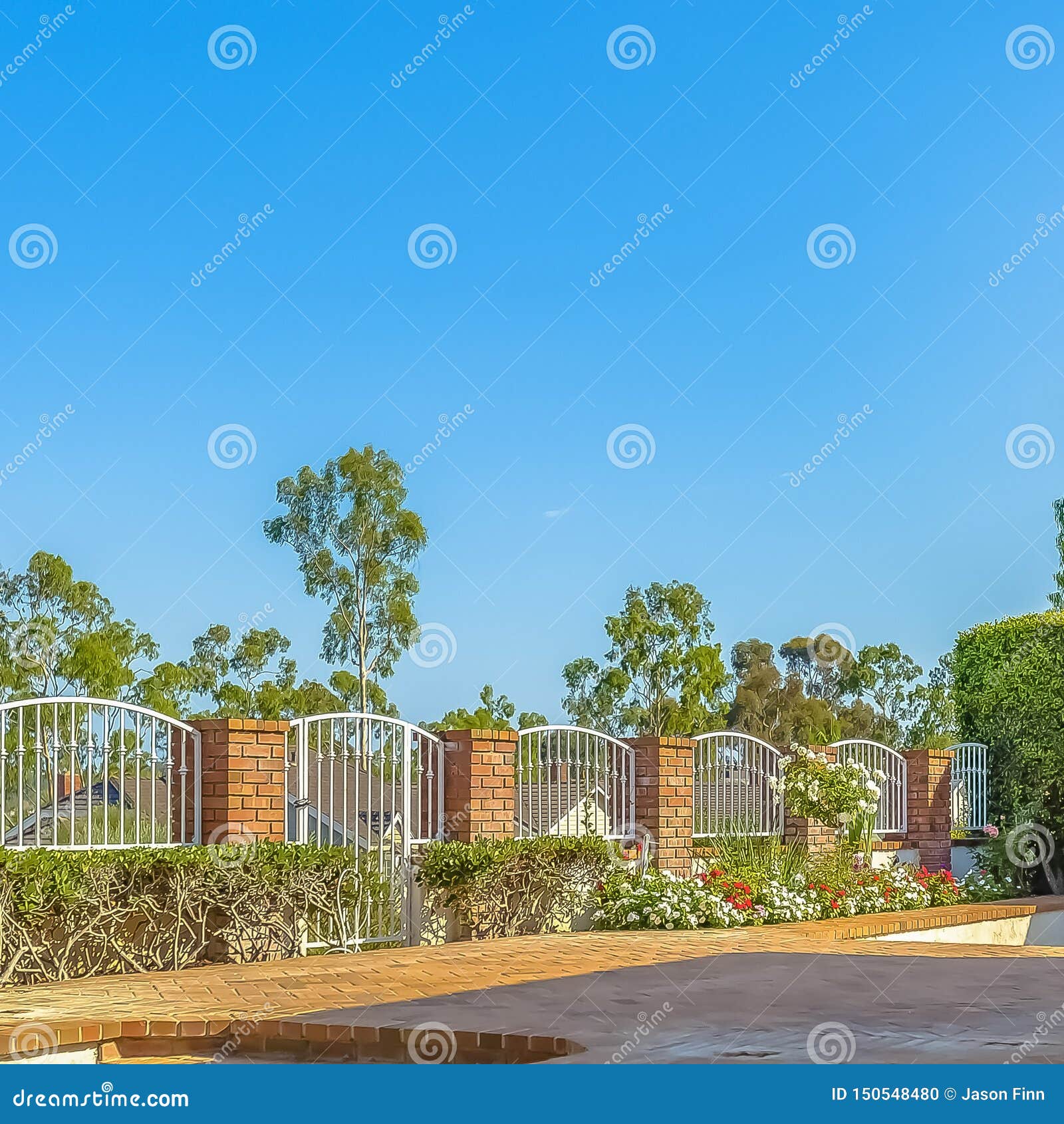 Square Frame Brick Patio With A Raised Platform In Front Of The Arched ...