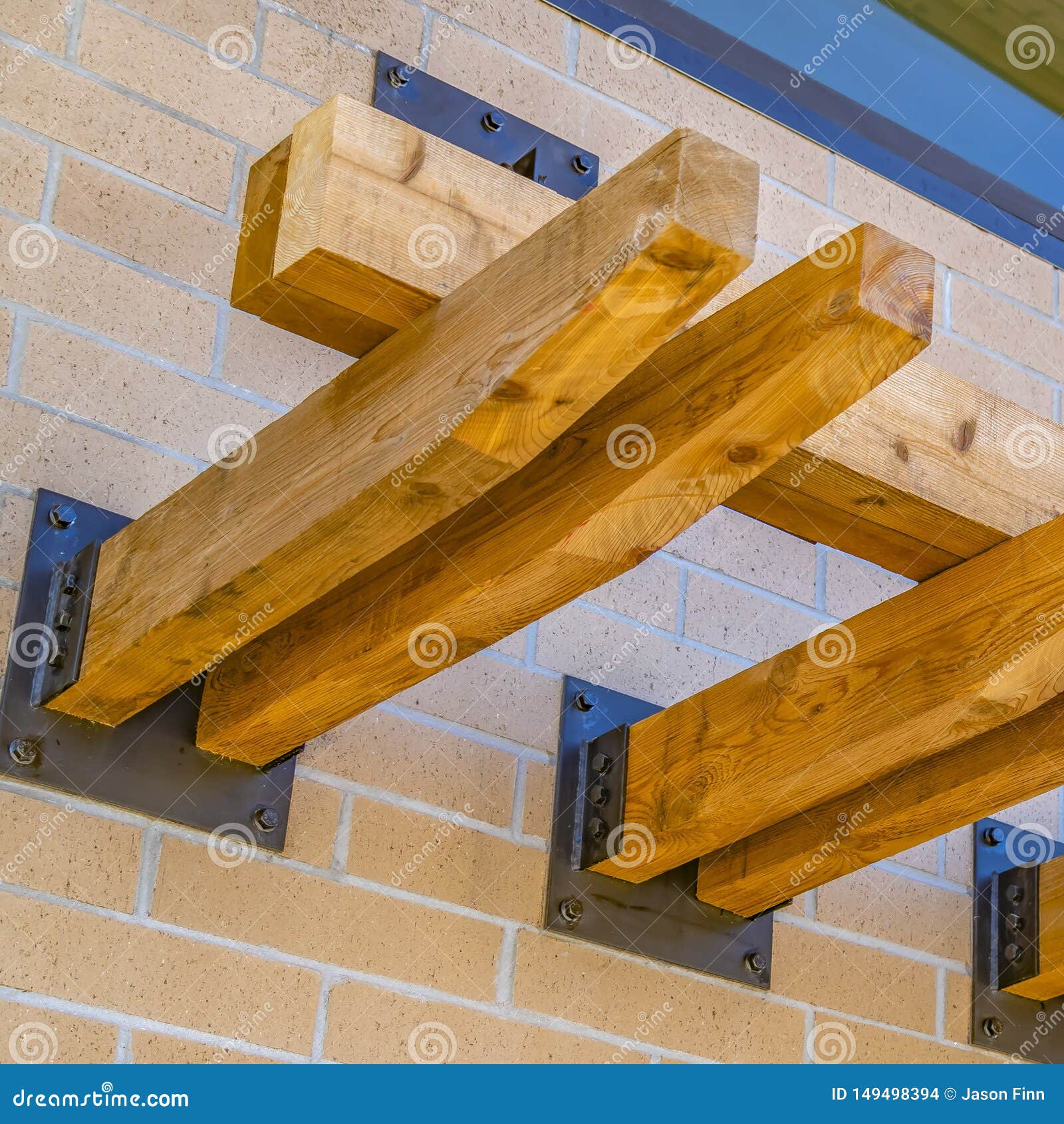 Square Frame Building with Decorative Woods Extending Horizontally from ...