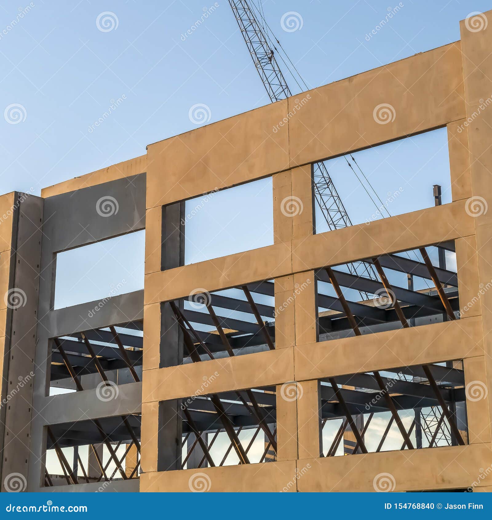 Square Frame Building Under Construction with Metal Crane and Blue Sky ...