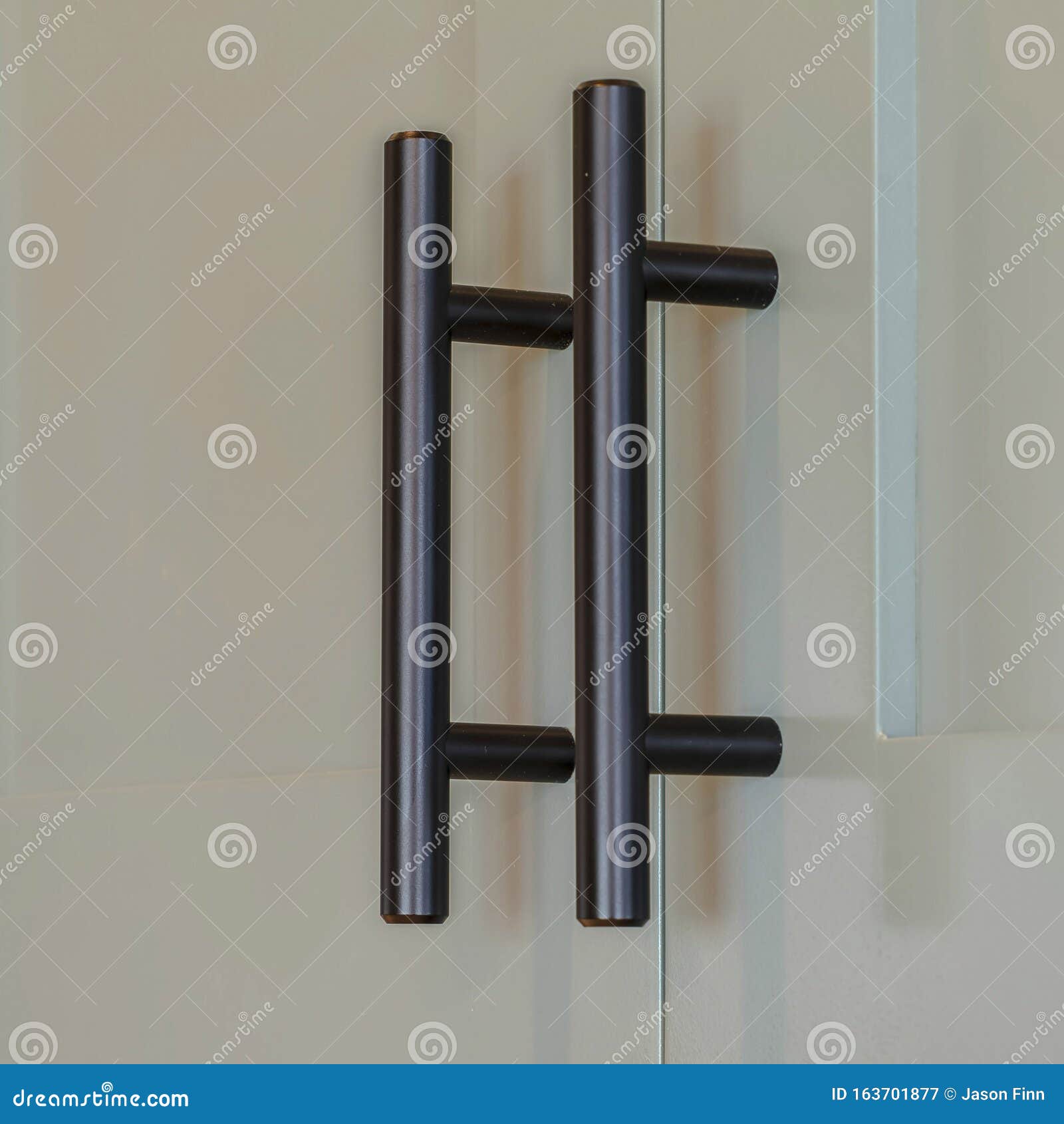 Square Frame Close Up of Overhead Kitchen Cupboards and Handles Stock ...