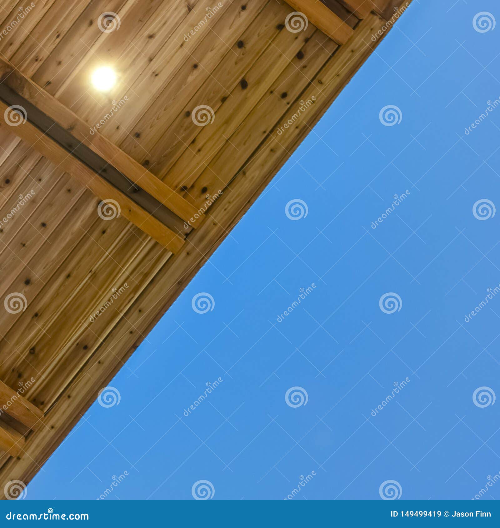 Square Frame Close Up View of the Underside of a Flat Roof with Blue ...