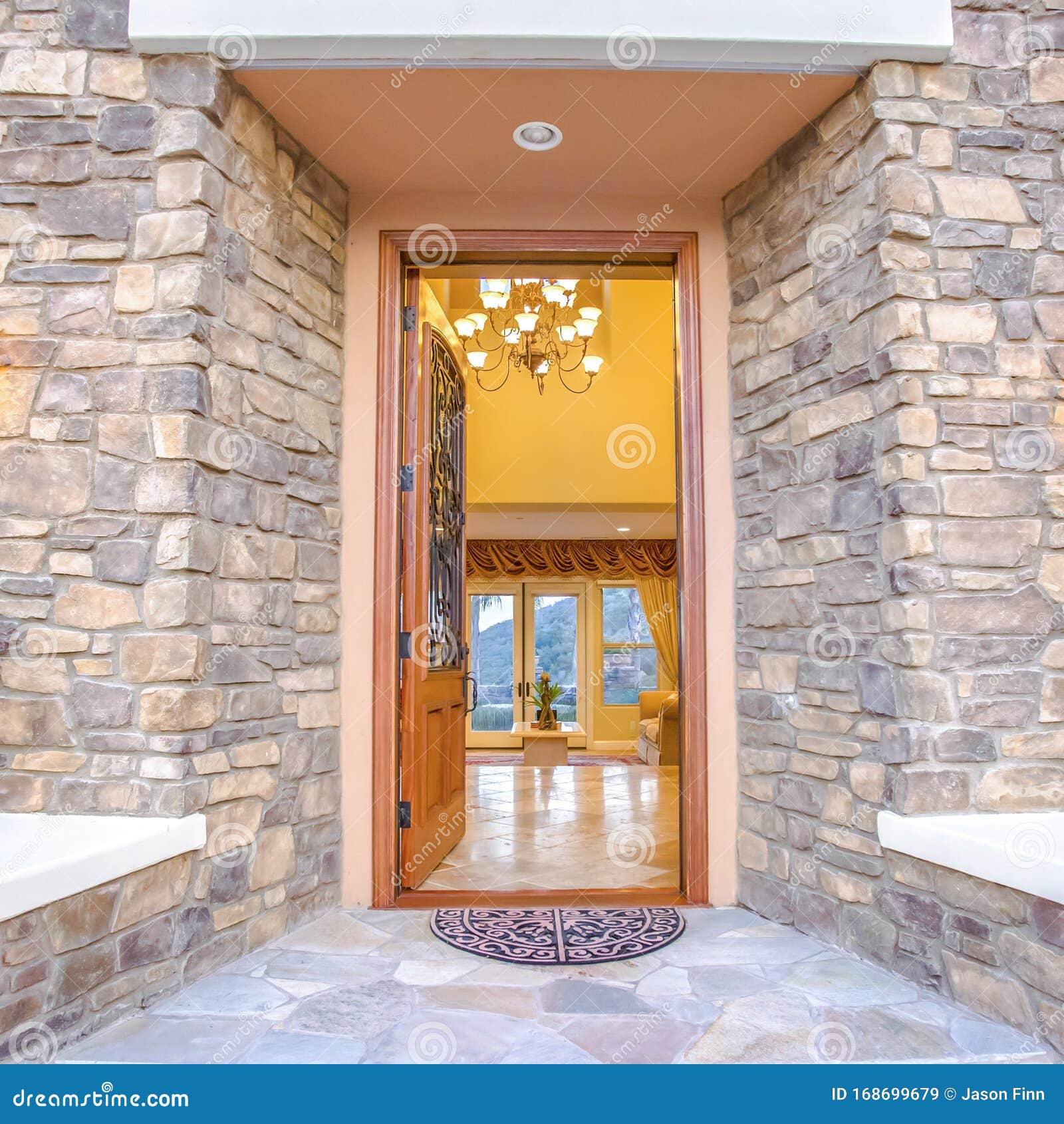 Square Frame Wide Open Front Door Looking at Chandlier Stock Image ...