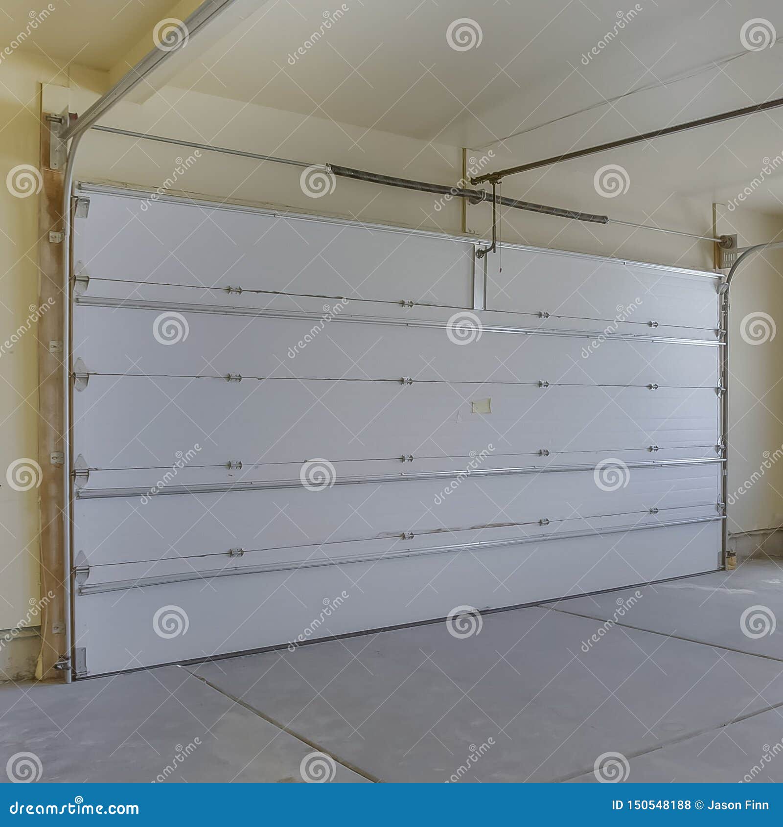 Square Frame Empty Garage with White Doors As Well As Arched and ...