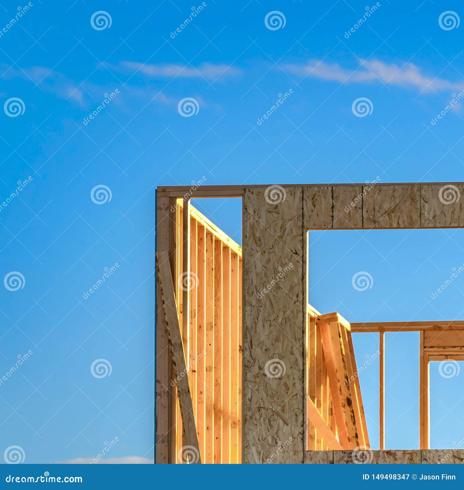 Square Frame House Framework at a Contruction Site with Mound of Soil ...