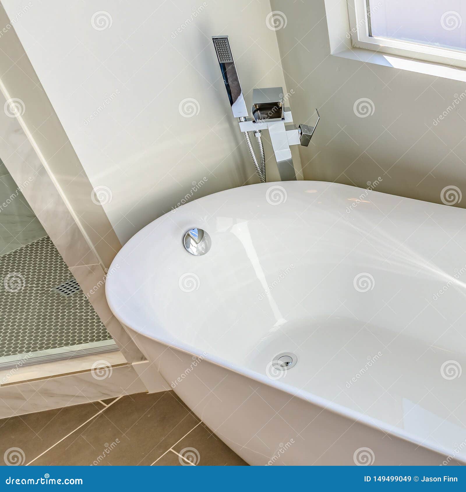 Square Frame Interior of a Bathroom with a Smooth and Glossy Bathtub in ...