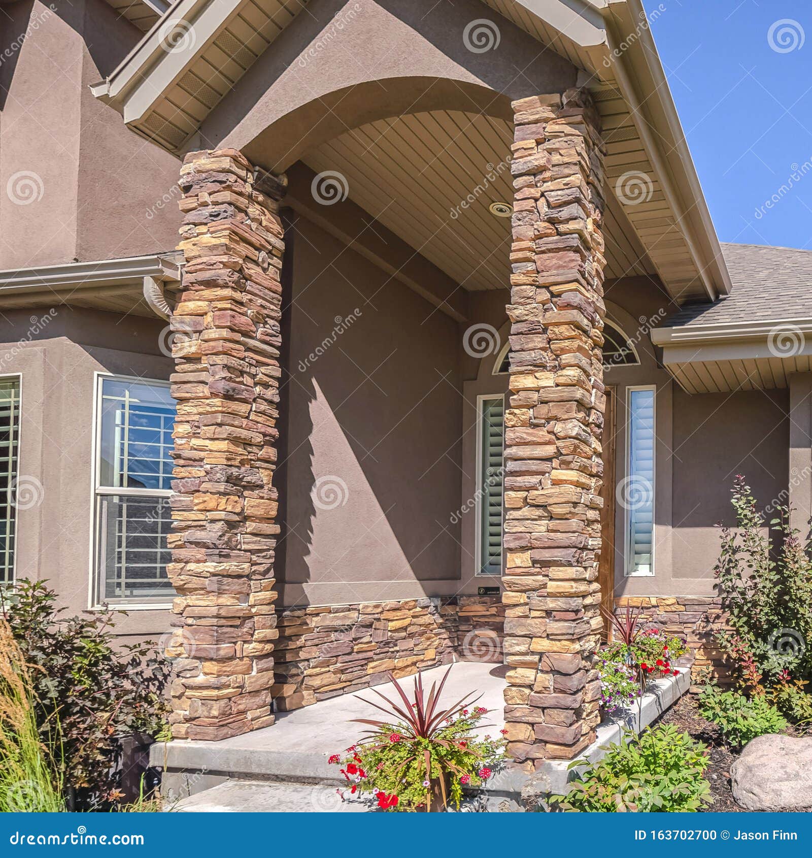 Square Frame Modern House and Front Yard with Stone Pillars Stock Photo ...