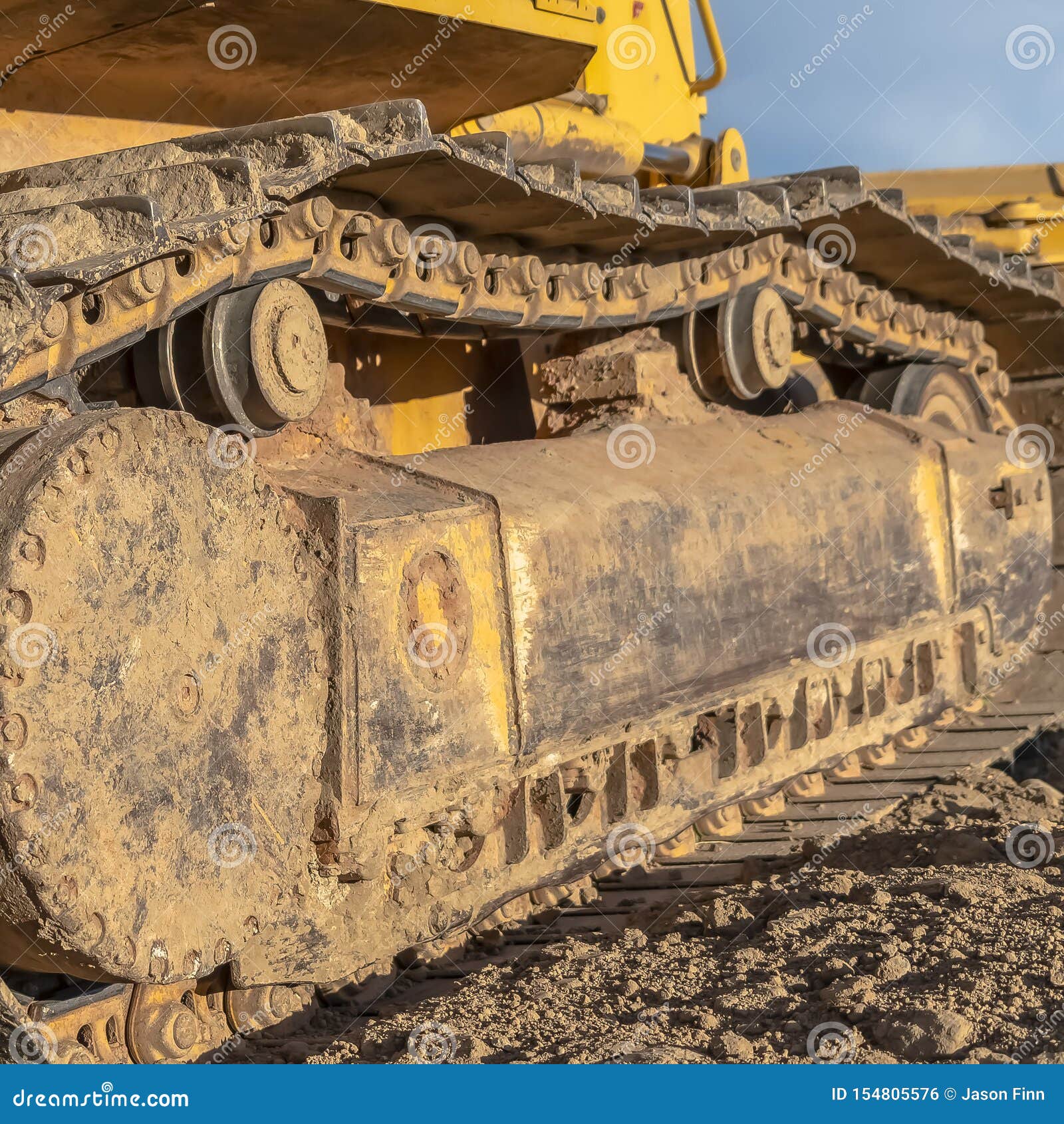 Square Frame Yellow Excavator with Close Up View of the Grouser Pad ...
