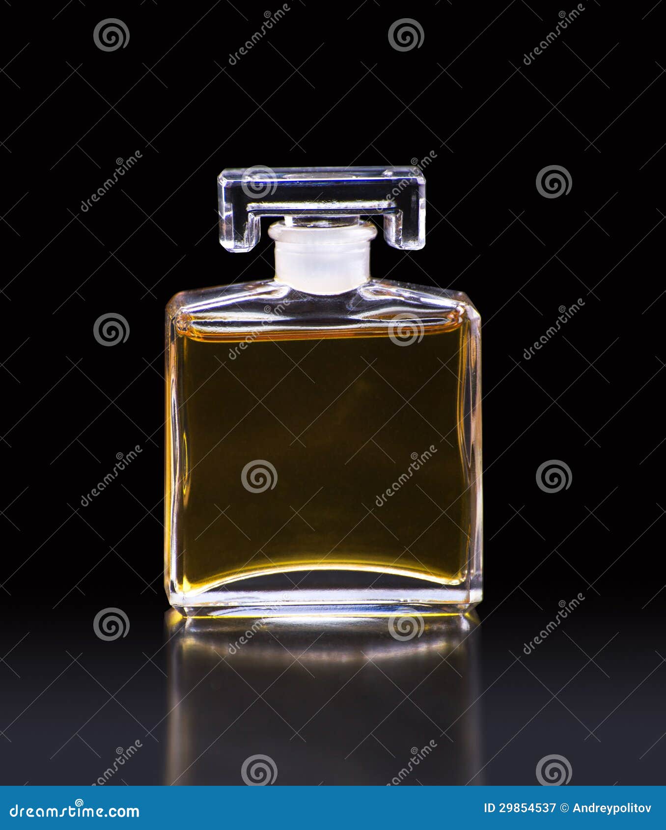 Bottle of Perfume with Yellow Liquid on Black Stock Image - Image of ...