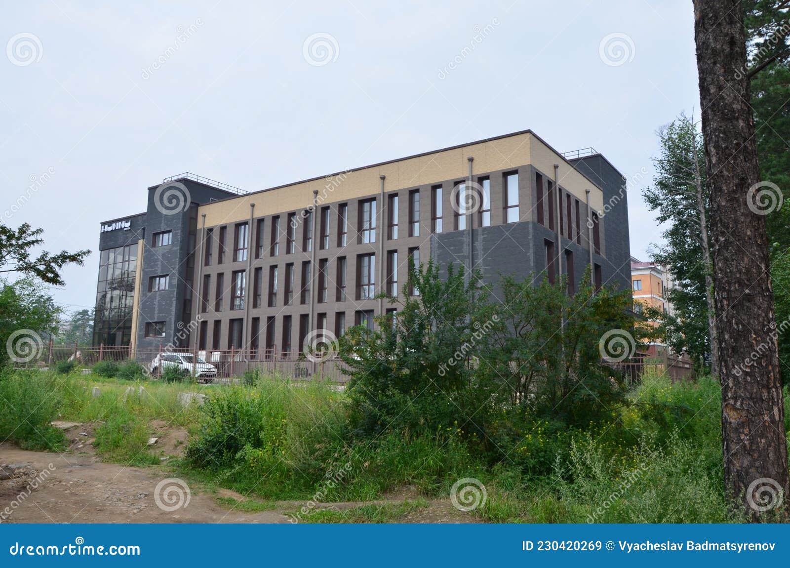 A Square Grey Building with Fence Editorial Stock Image - Image of ...