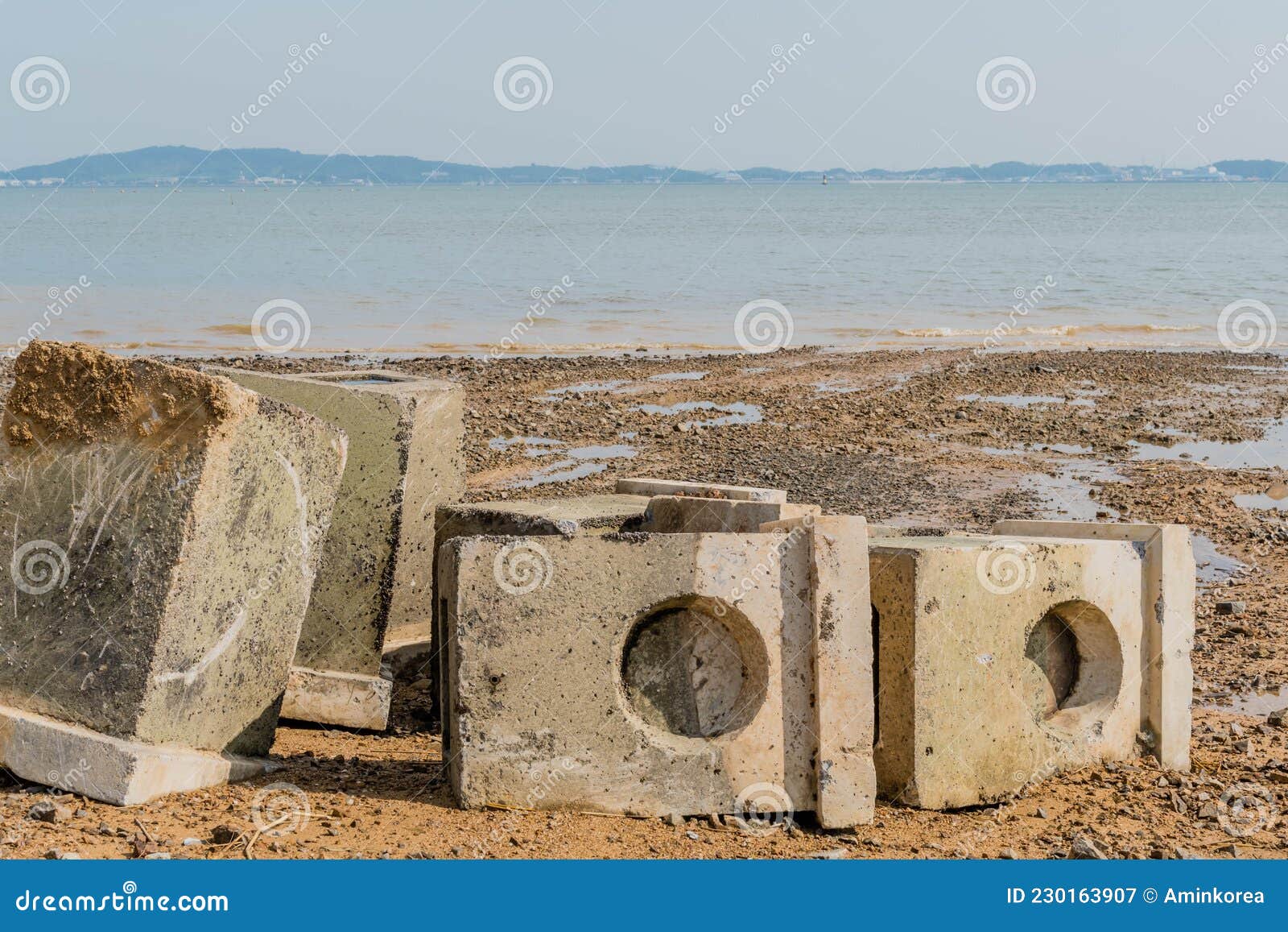 Square Industrial Concrete Blocks Laying in Mud Stock Image - Image of ...