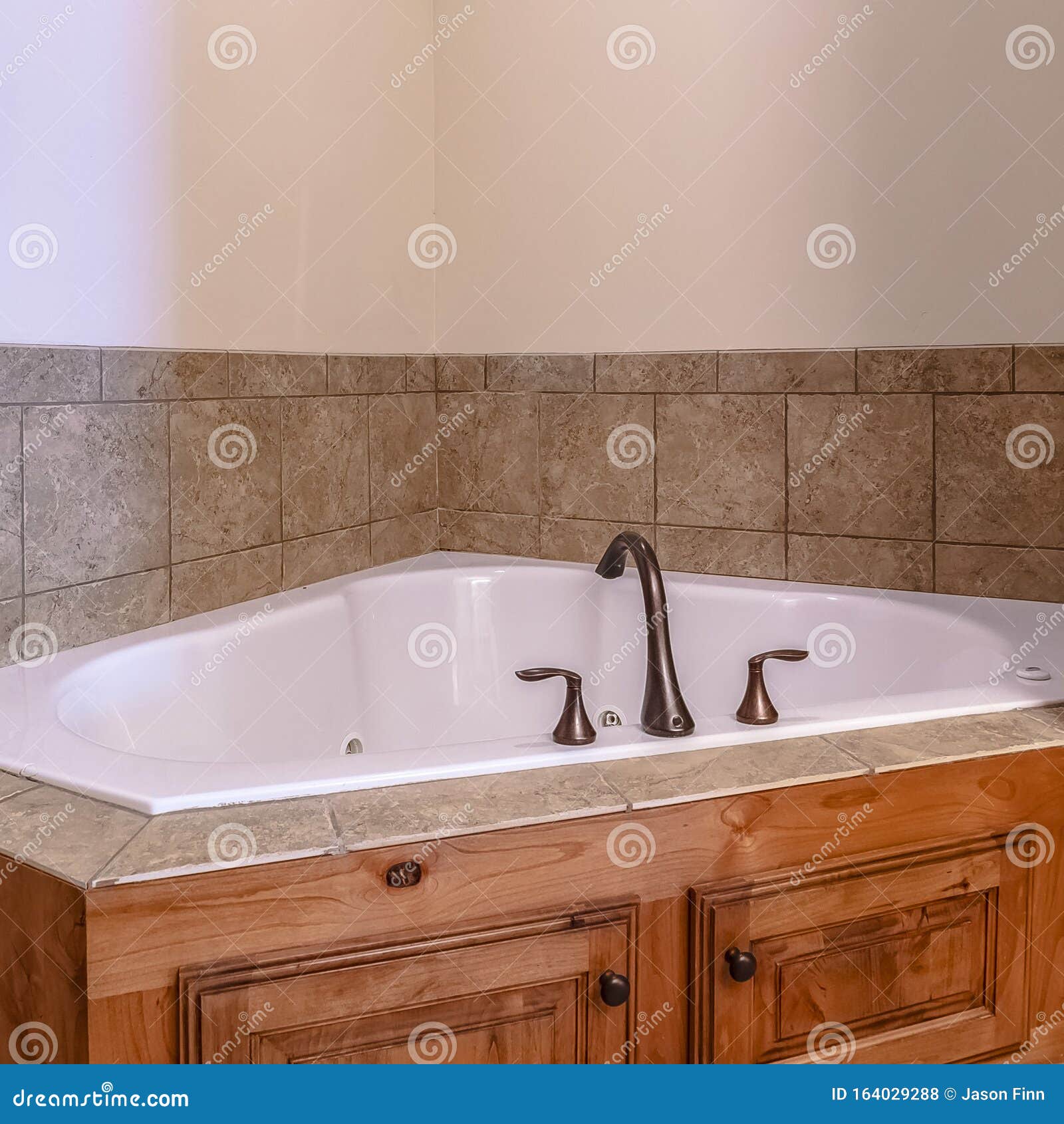 Square Interior of a Modern Bathroom with Corner Bath Stock Photo ...