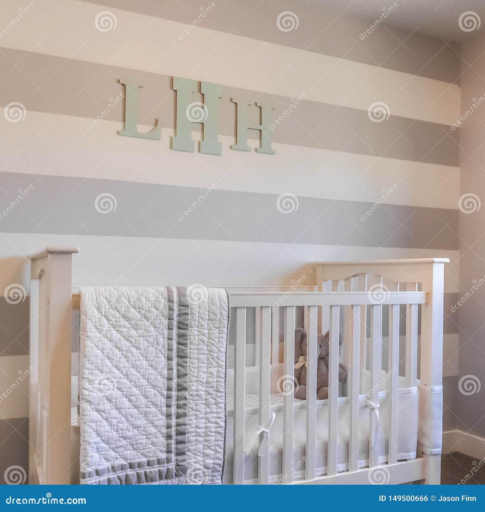 Square Interior of a Nursery with White Crib and Monogram Letters on ...