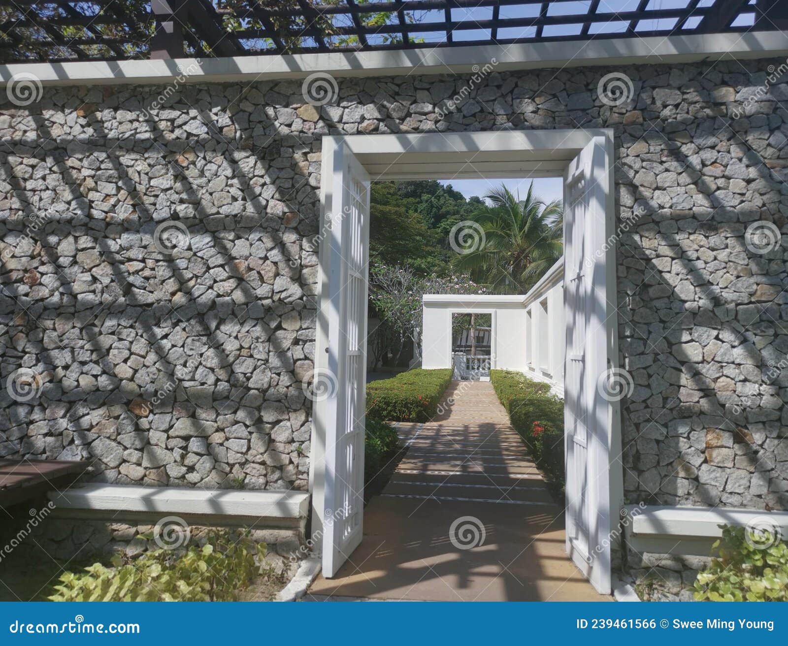 Square Pathway And Stairs Leading To The Porch With Pillars At The ...