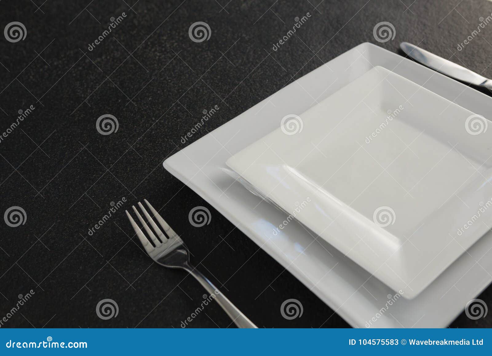 Square Plates and Cutlery Set on a Table Stock Image - Image of party ...