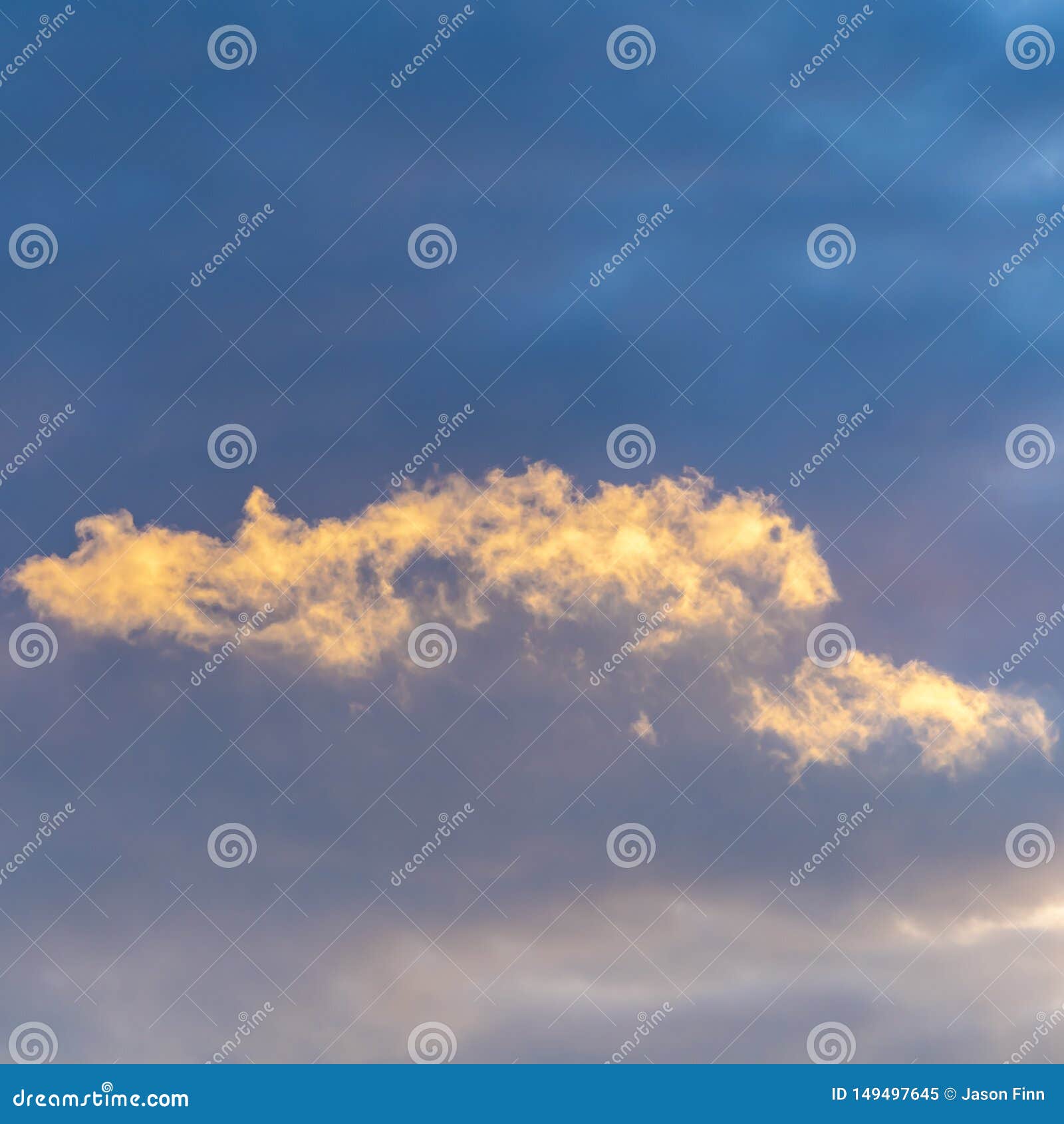 Square Puffy Clouds Illuminated by Sunlight in the Boundless Blue Sky ...