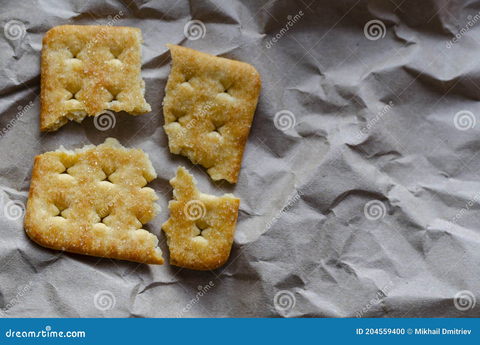 Square Saltine Cracker is Broken into Four Random Pieces Stock Photo ...