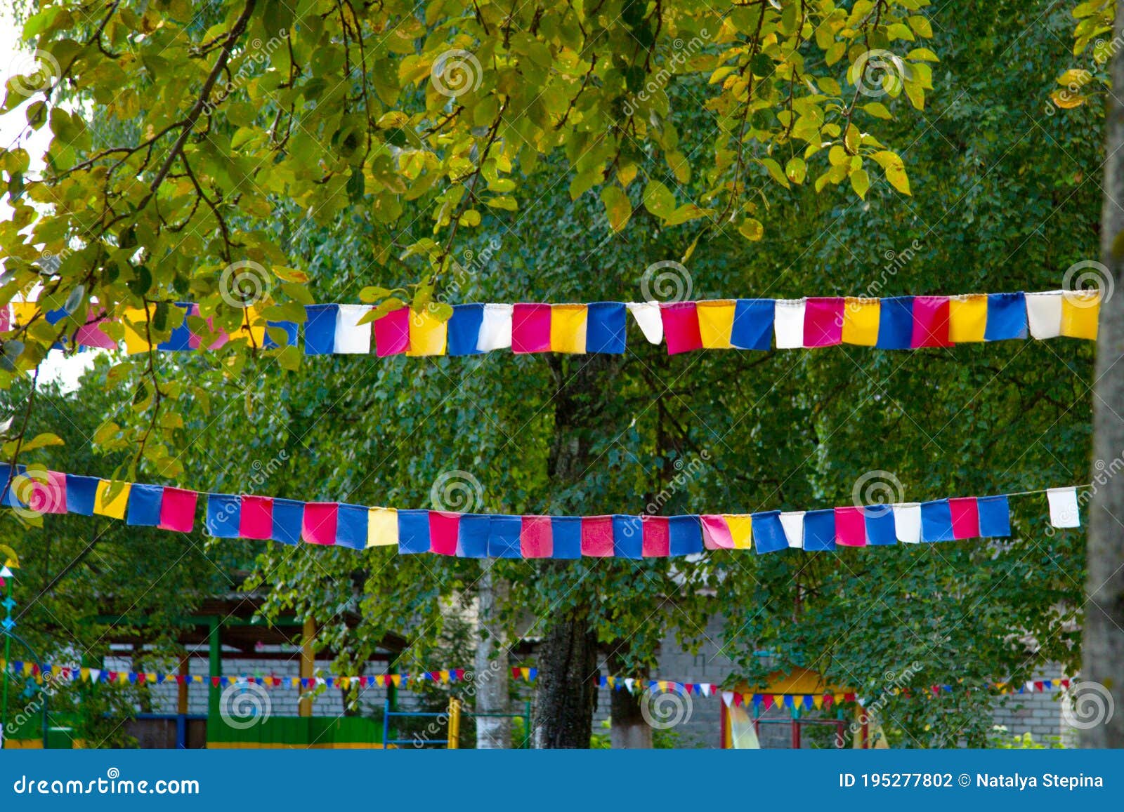 Square Small Flags of Red, White, Yellow, Blue are Hanging on a Rope ...