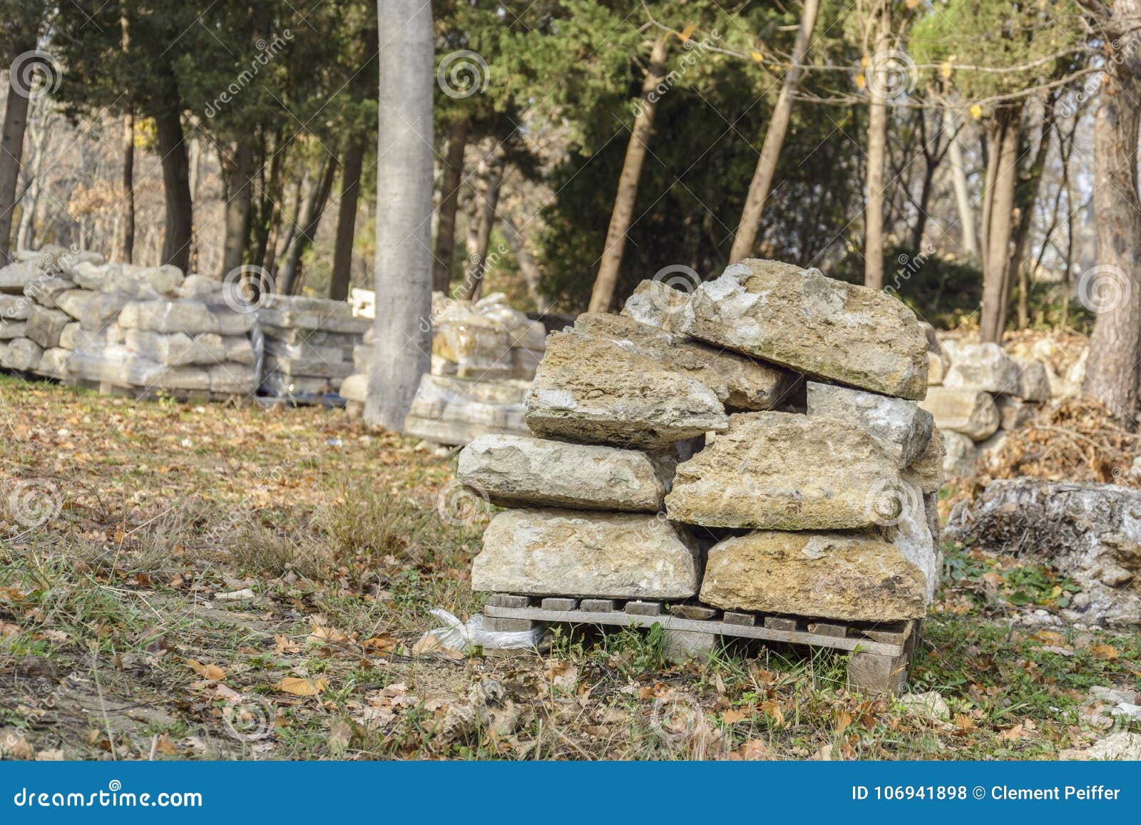 Square Stack Of Pipes With A Golden Sun Setting Behind A Mountain In ...