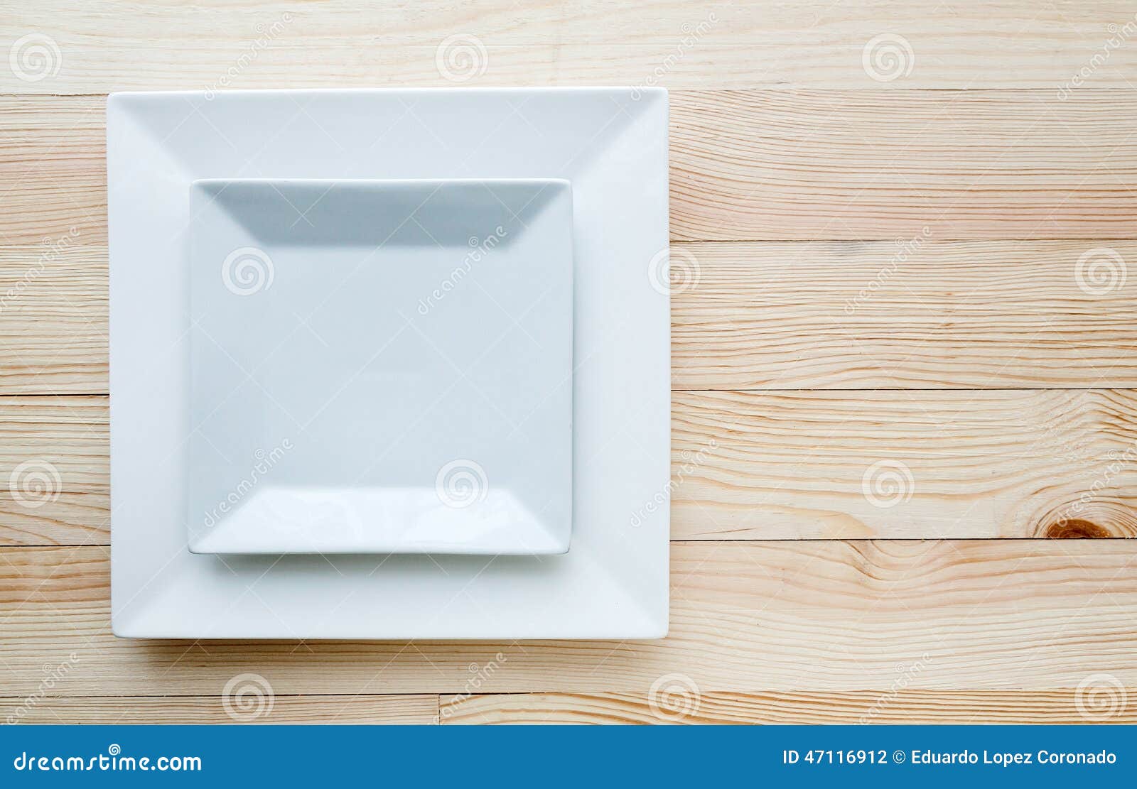 Square White Plates Over Wooden Table Stock Photo - Image of simple ...