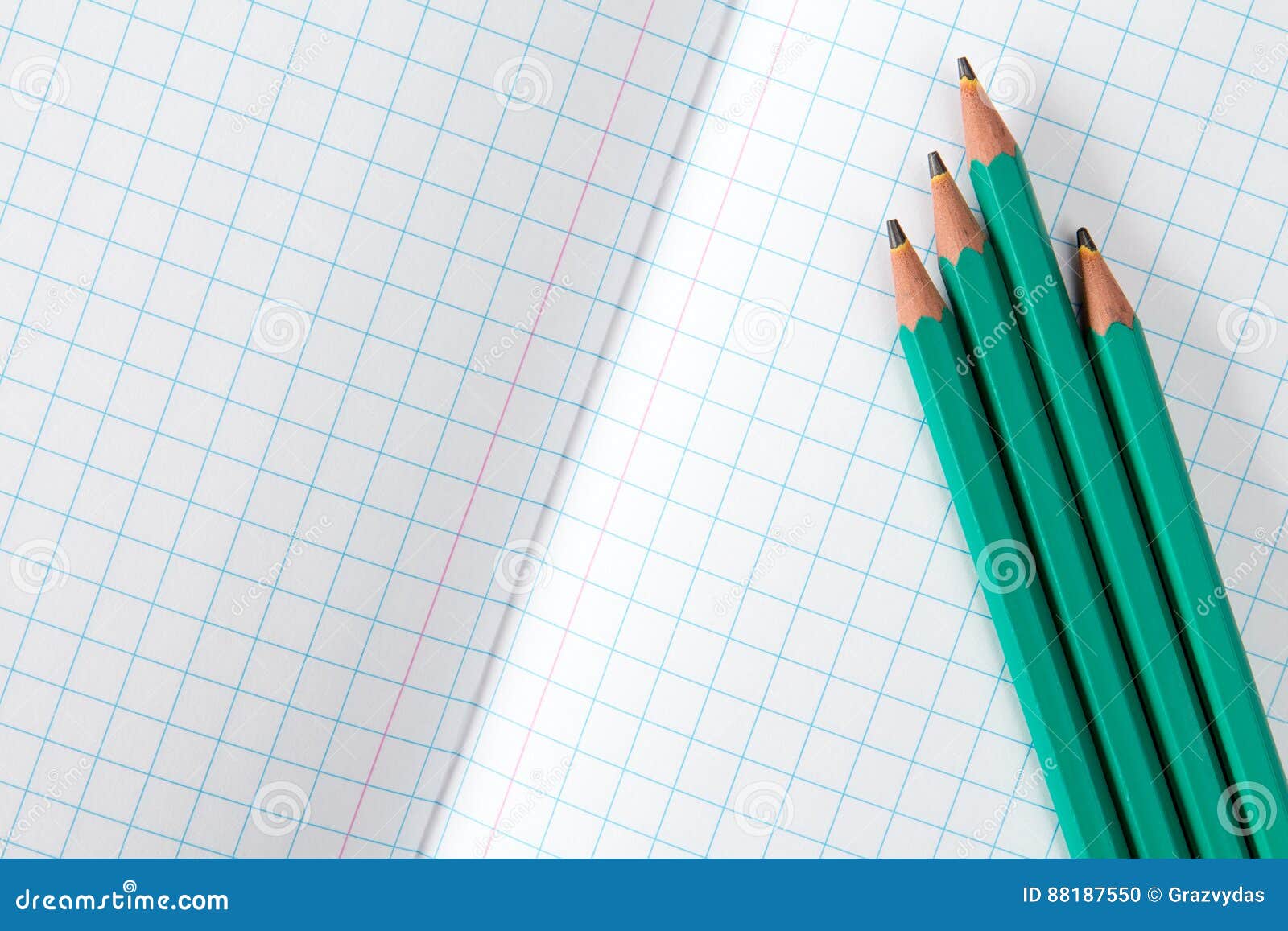 Squared Exercise Book and Four Pencils Stock Photo - Image of book ...