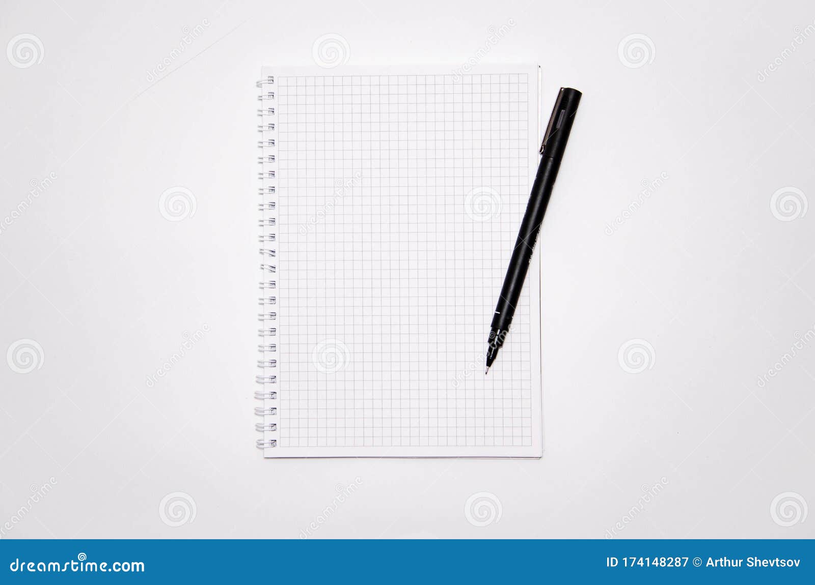 Squared Notebook with Black Pen on a White Background. Record Ideas ...