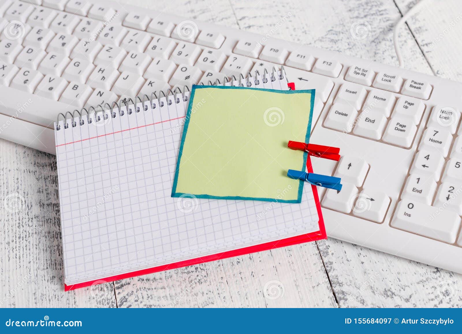 Squared Paper Notebook with a Rectangle Shaped Empty Note Above Pinned ...