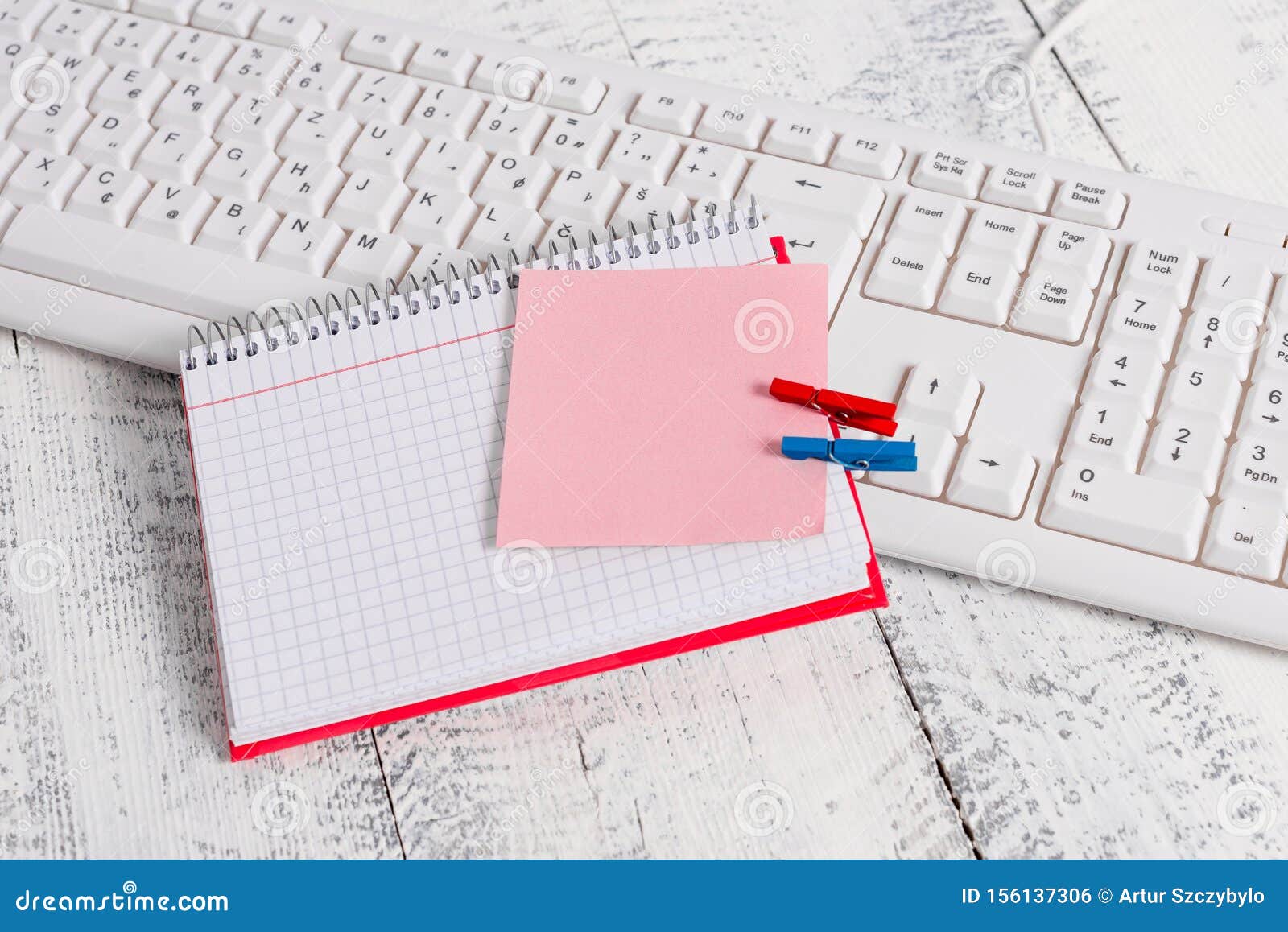 Squared Paper Notebook with a Rectangle Shaped Empty Note Above Pinned ...