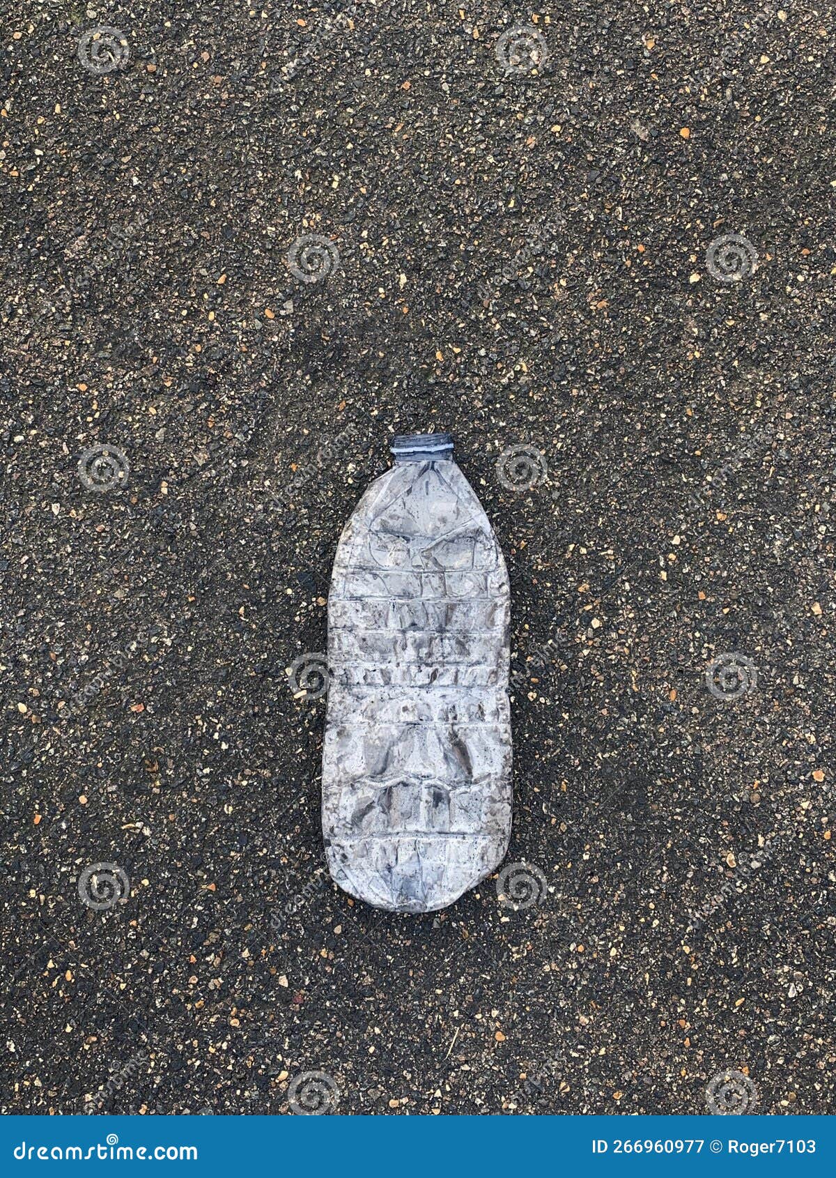 A Squashed Plastic Bottle Lying in the Road Stock Image - Image of ...