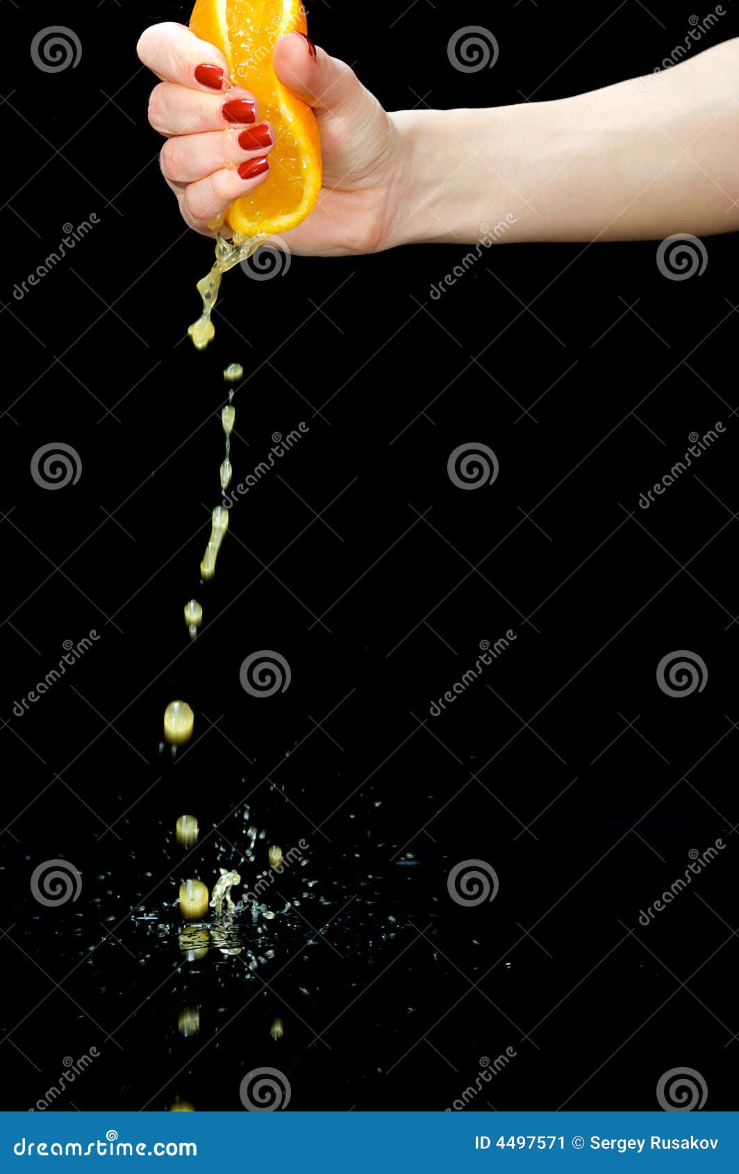 Squeezing an orange stock image. Image of fingers, black - 4497571