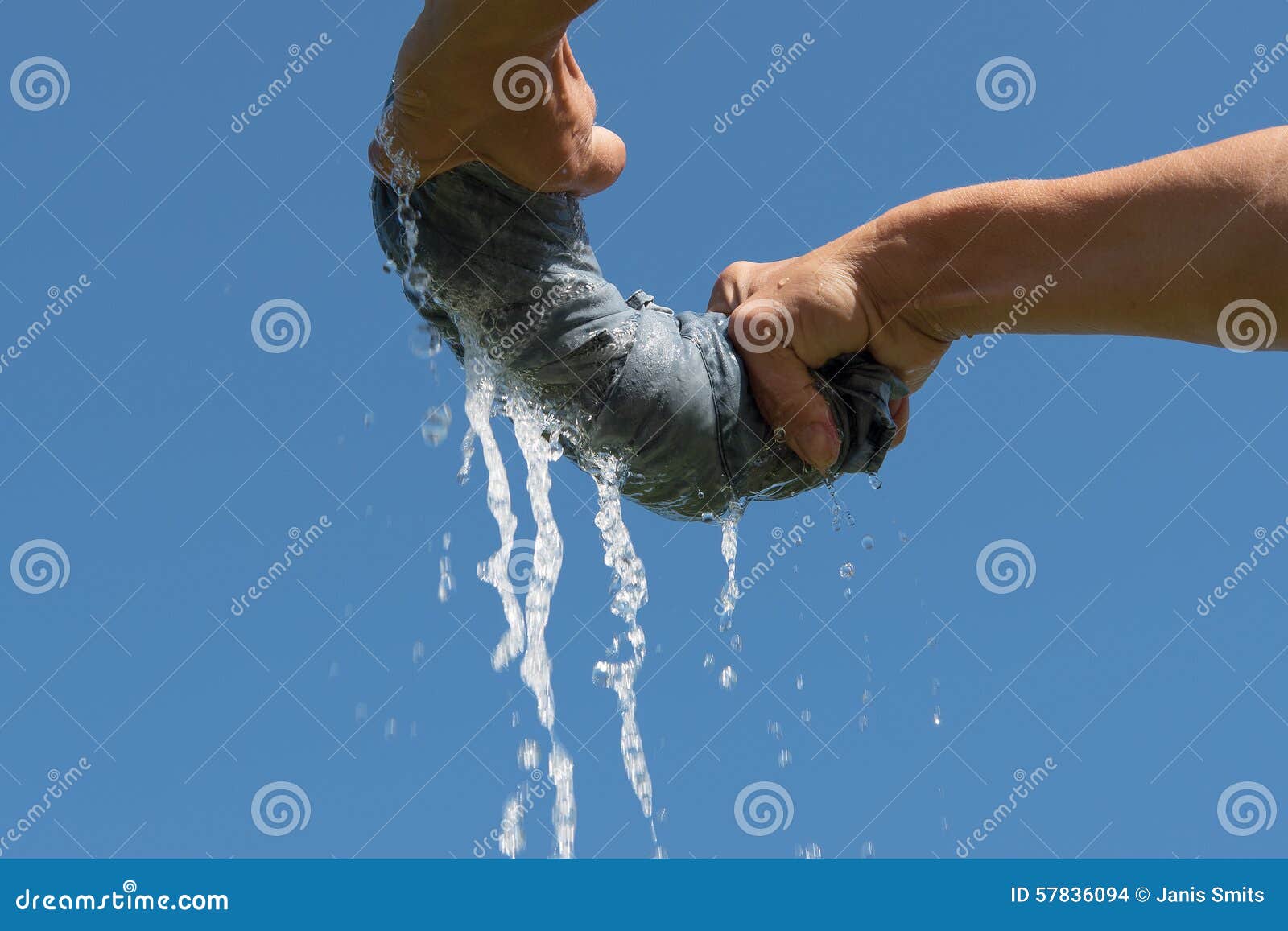 Squeezing of wet fabric. stock photo. Image of cloth - 57836094
