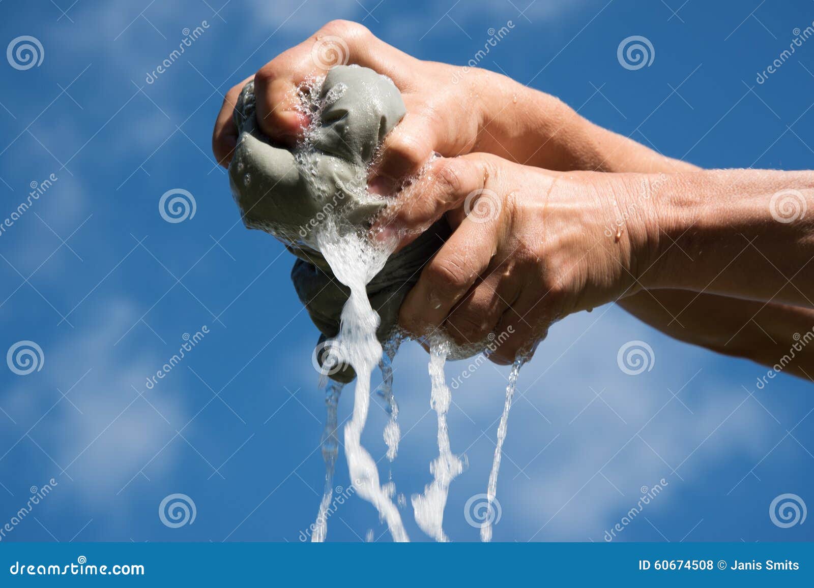 Squeezing of wet fabric. stock photo. Image of squeeze - 60674508