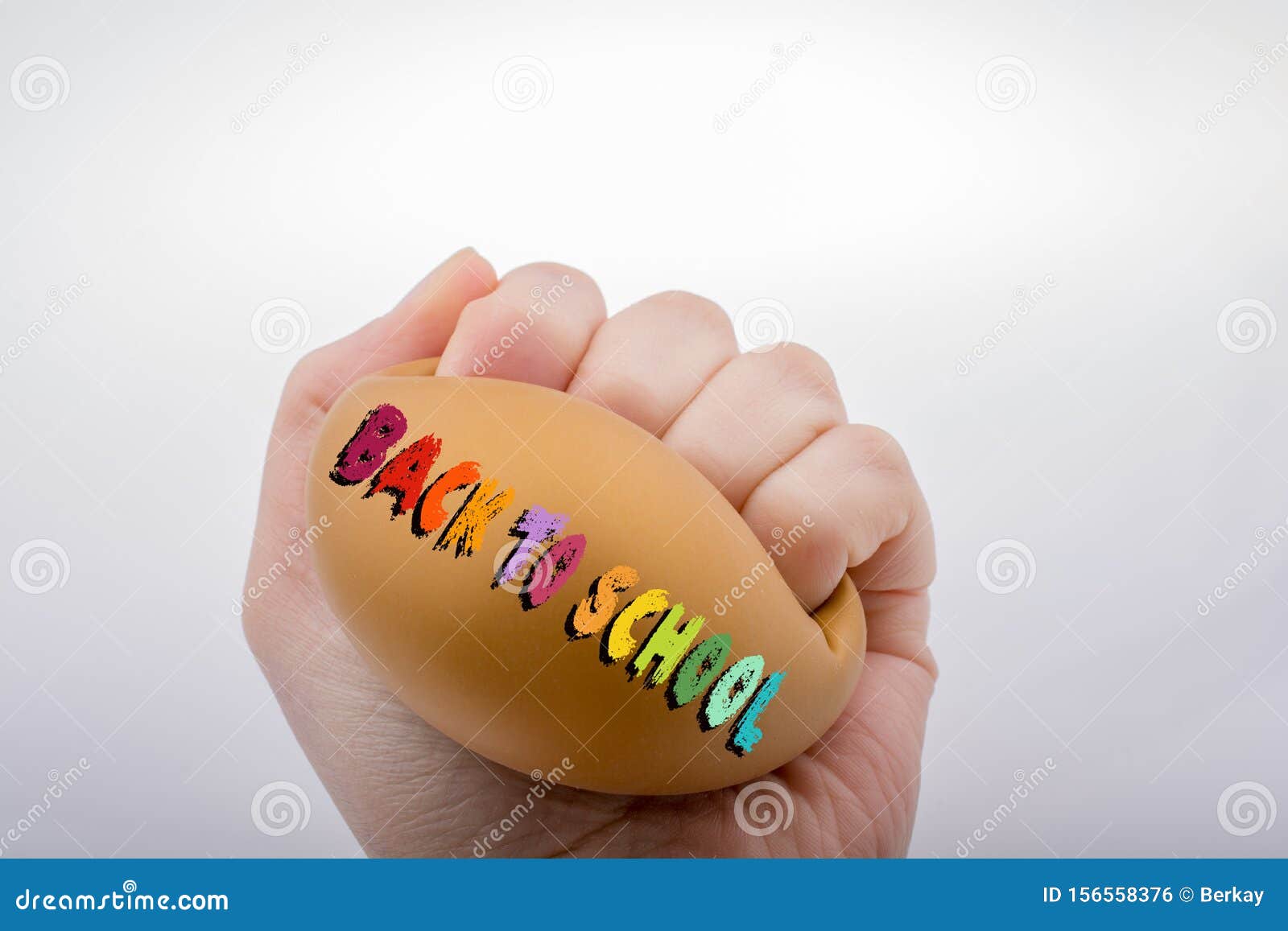 Squeezing Yellow Balloon with Hand Stock Photo - Image of frustration ...