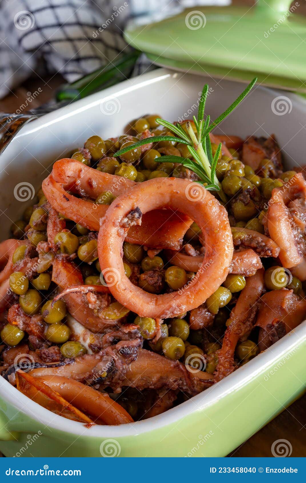 Squid Cut in a Circle with Peas and Tomato Stock Photo - Image of board ...
