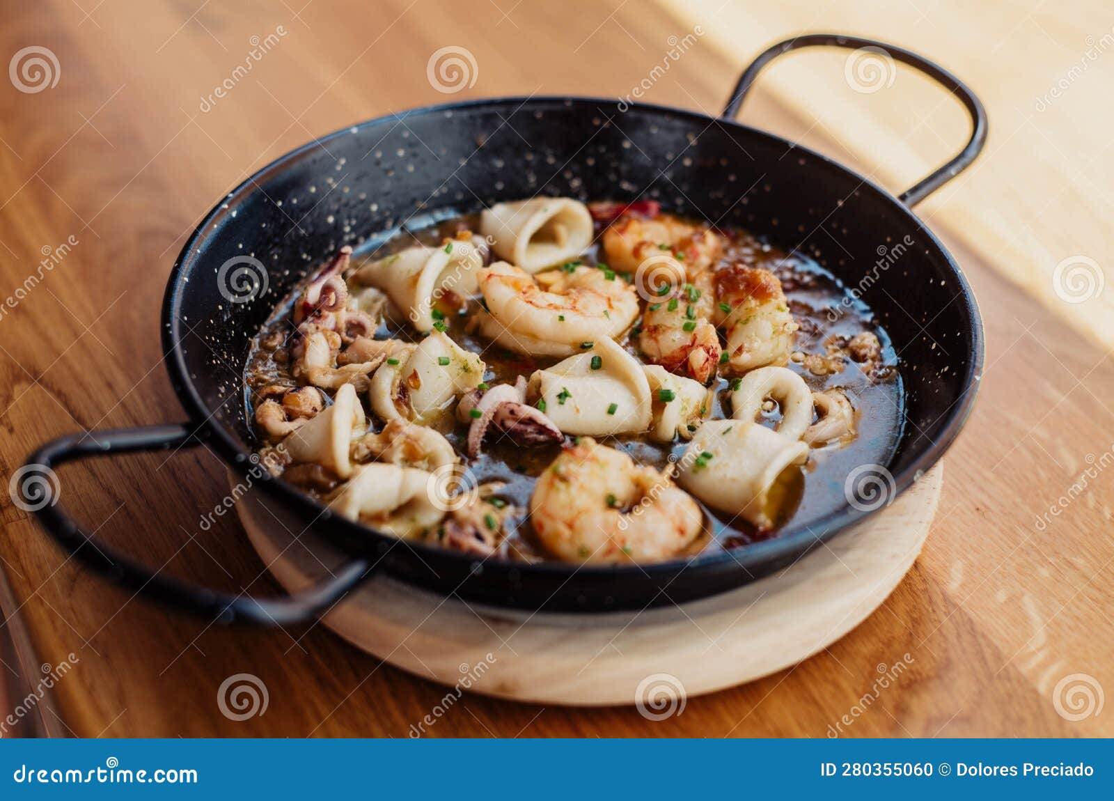 Squid and Garlic Prawns Portion in a Tapas Bar Stock Photo - Image of ...