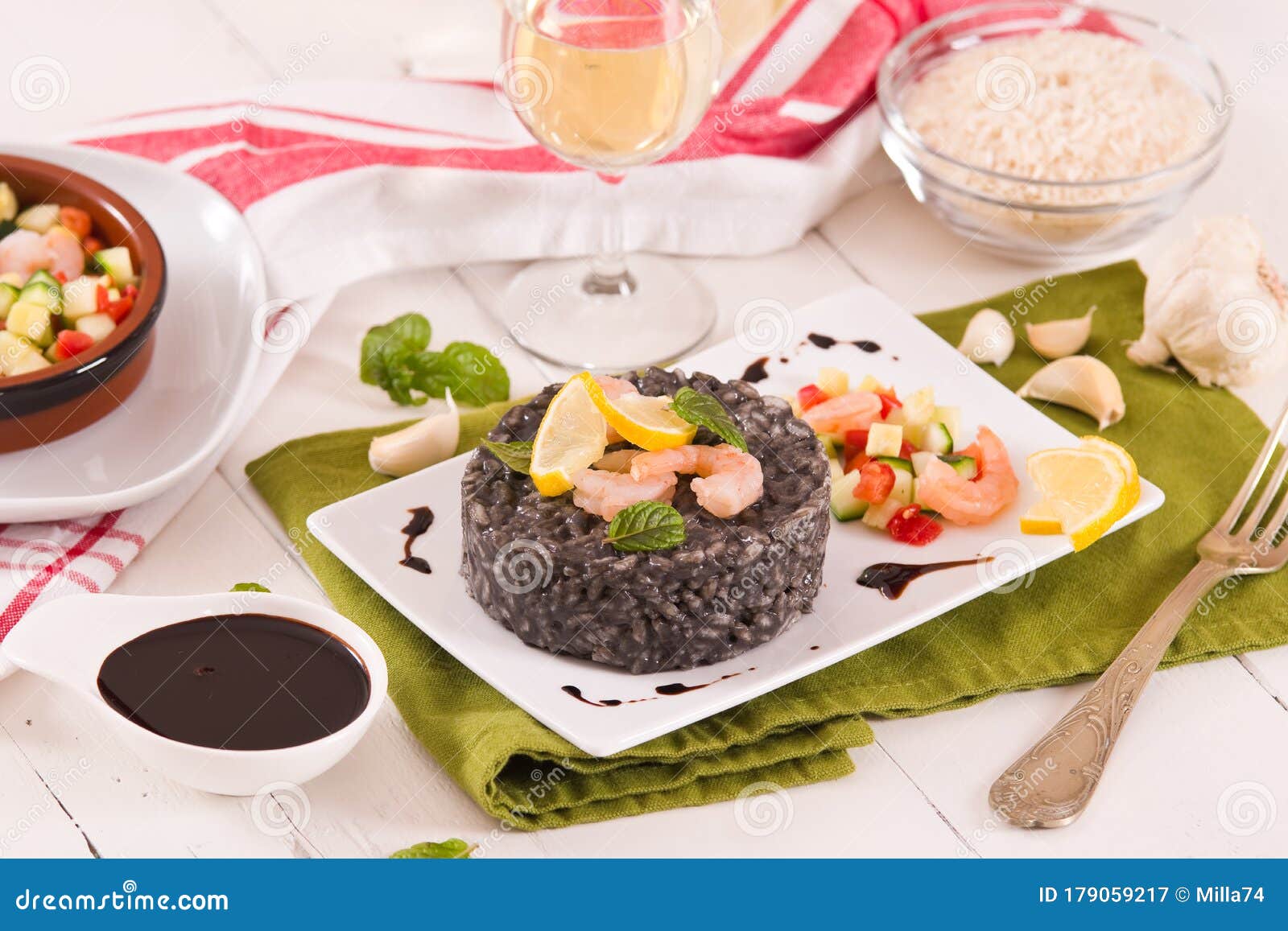 Squid ink risotto. stock image. Image of black, lemon - 179059217