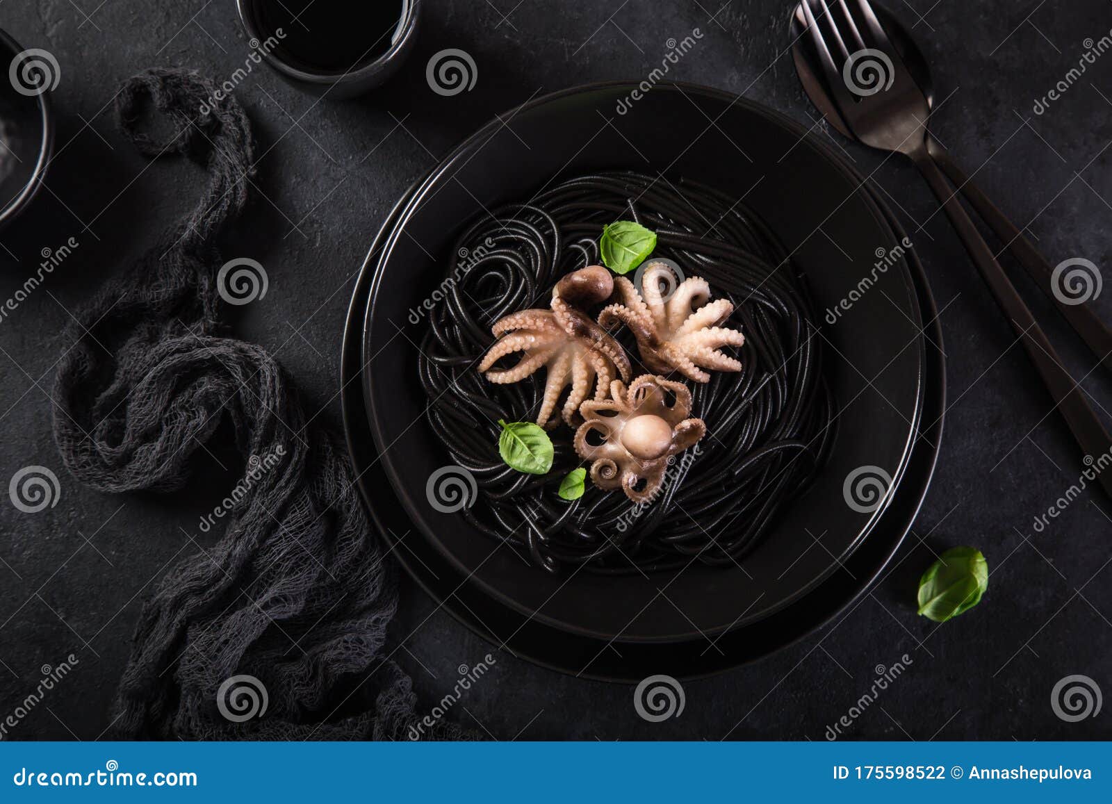 Black Squid Ink Spaghetti Pasta with Octopuses in Black Bowl Stock ...