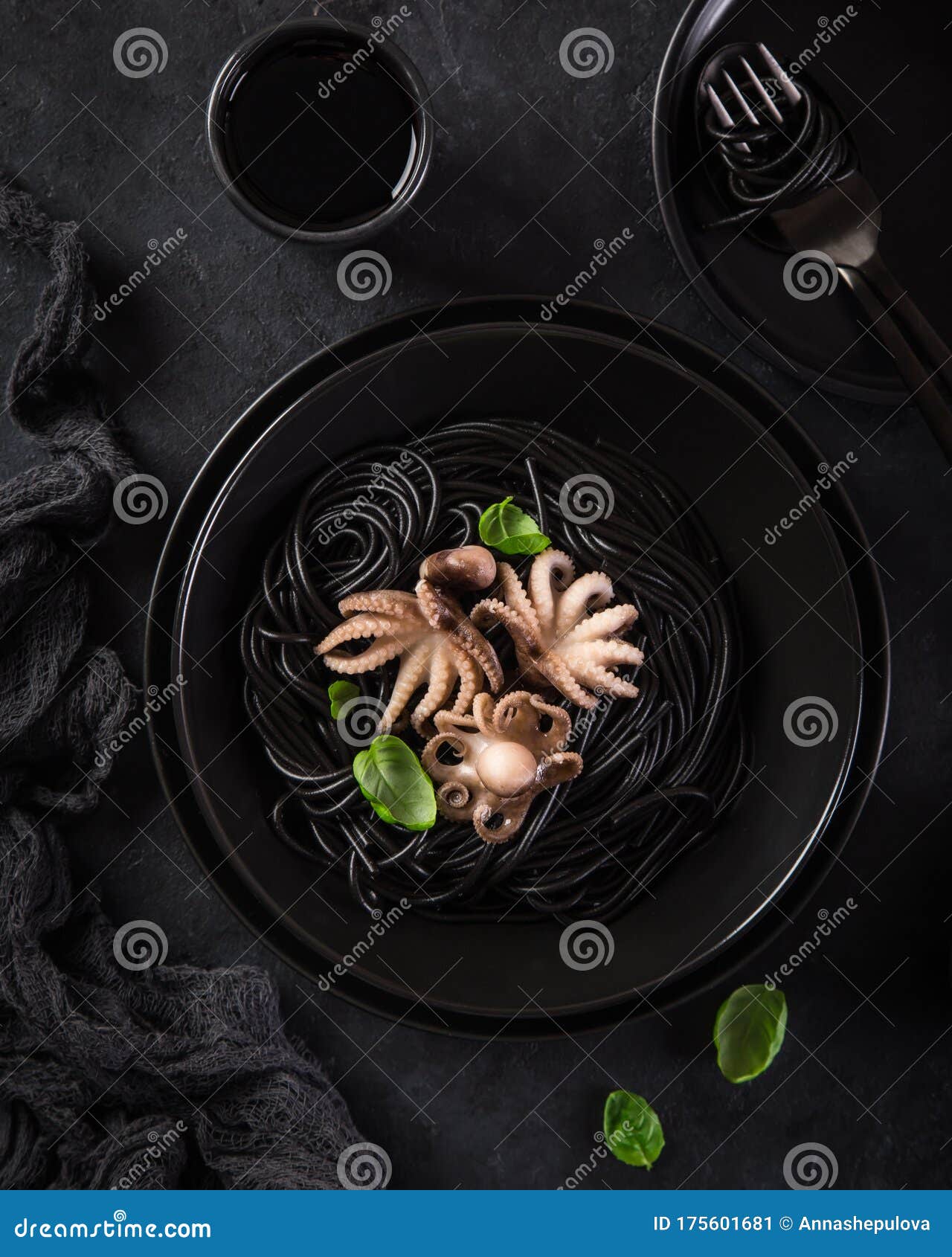 Squid Ink Spaghetti Pasta with Octopuses in Black Bowl Stock Image ...