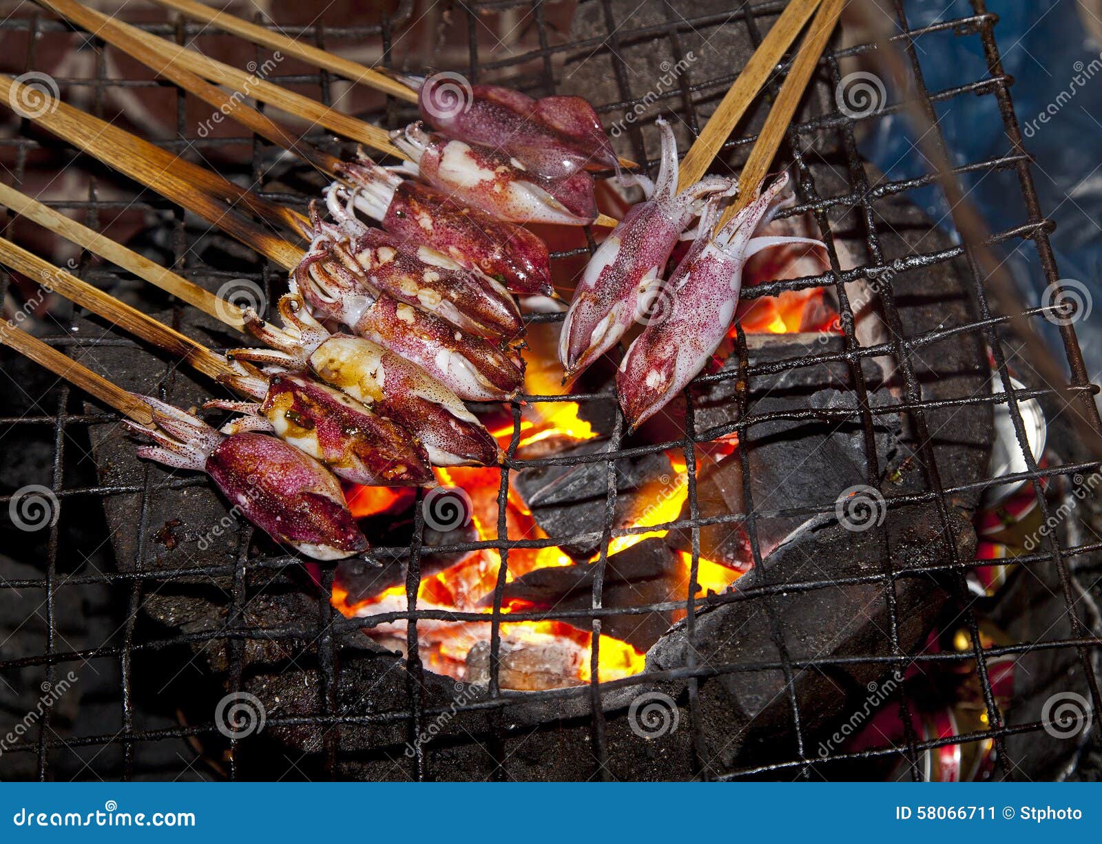 Squids on grill stock image. Image of cambodia, barbecue - 58066711