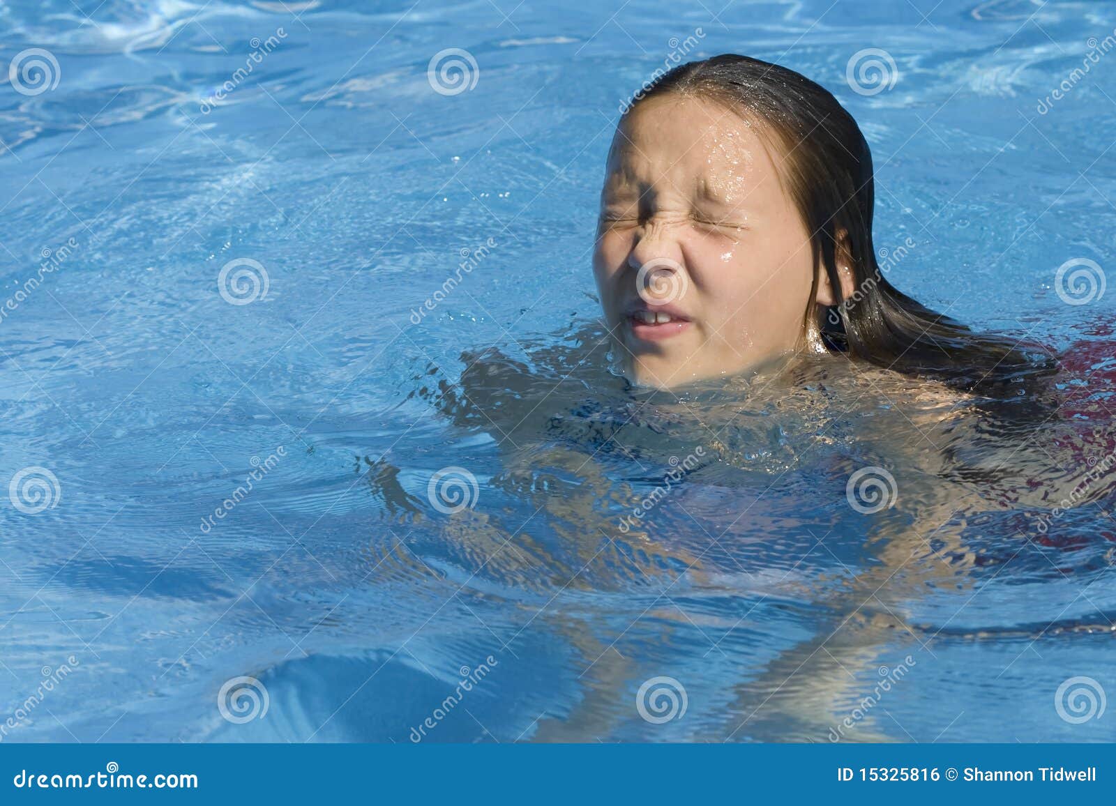 Squinting girl in pool stock photo. Image of face, beautiful - 15325816