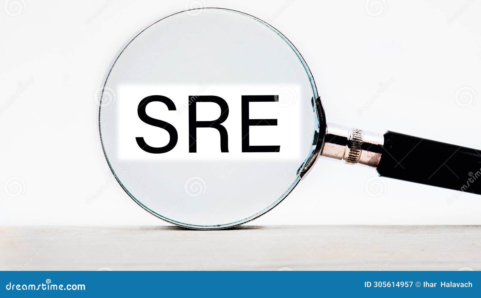 SRE. Site Reliability Engineering Lettering on through a Magnifying ...