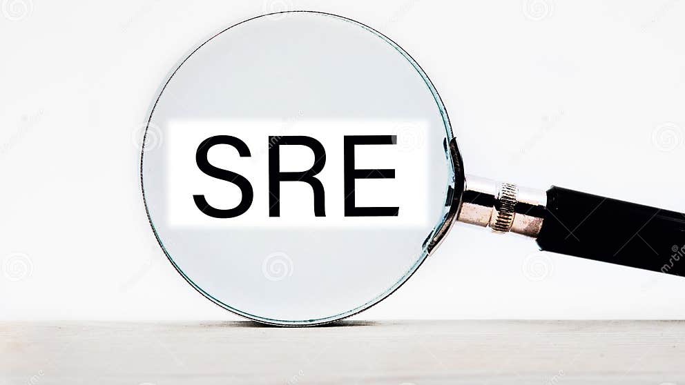 SRE. Site Reliability Engineering Lettering on through a Magnifying ...