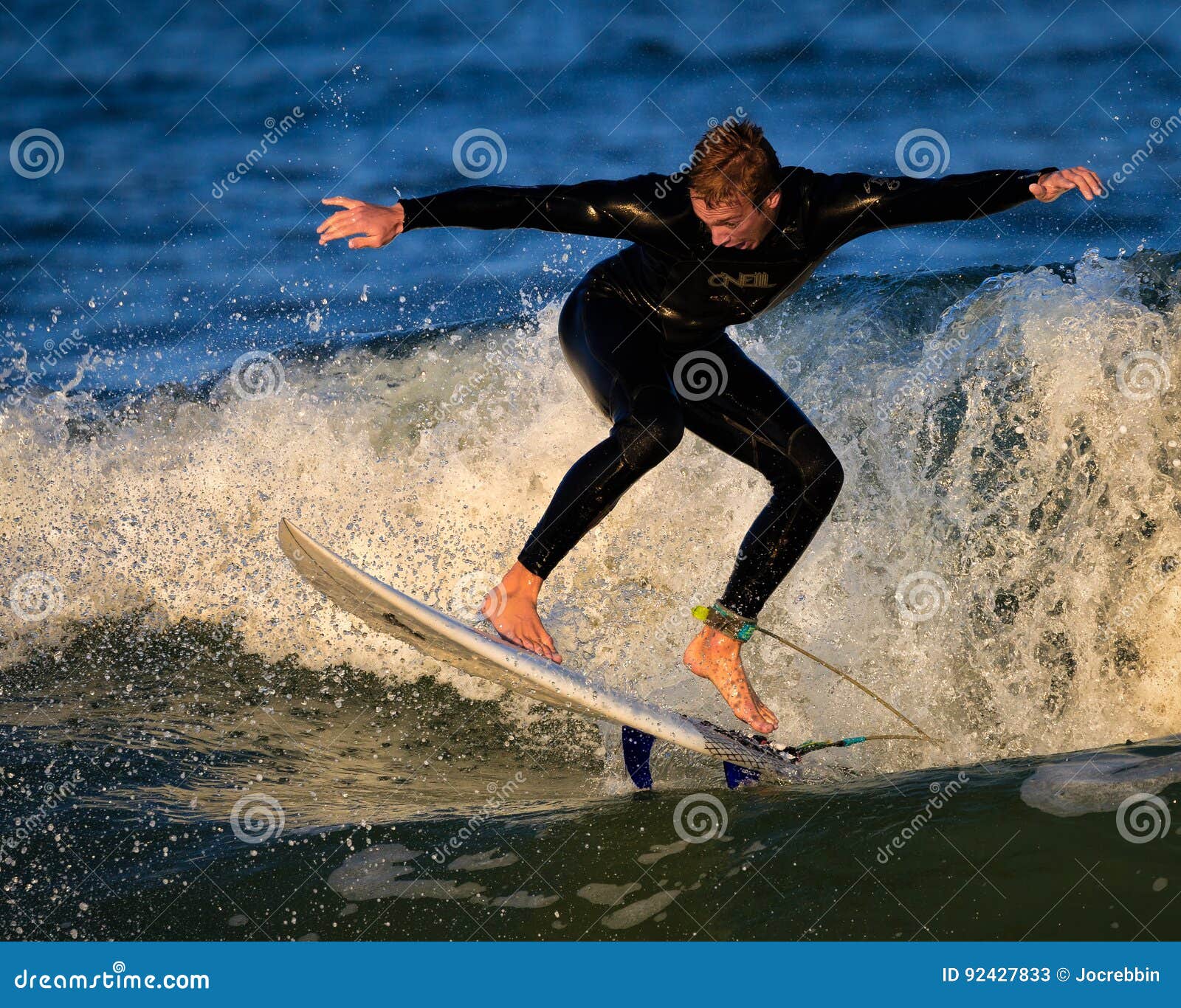St. Augustine, FL - FEb 17 - Surfer Rides the Waves at Sunset in St ...