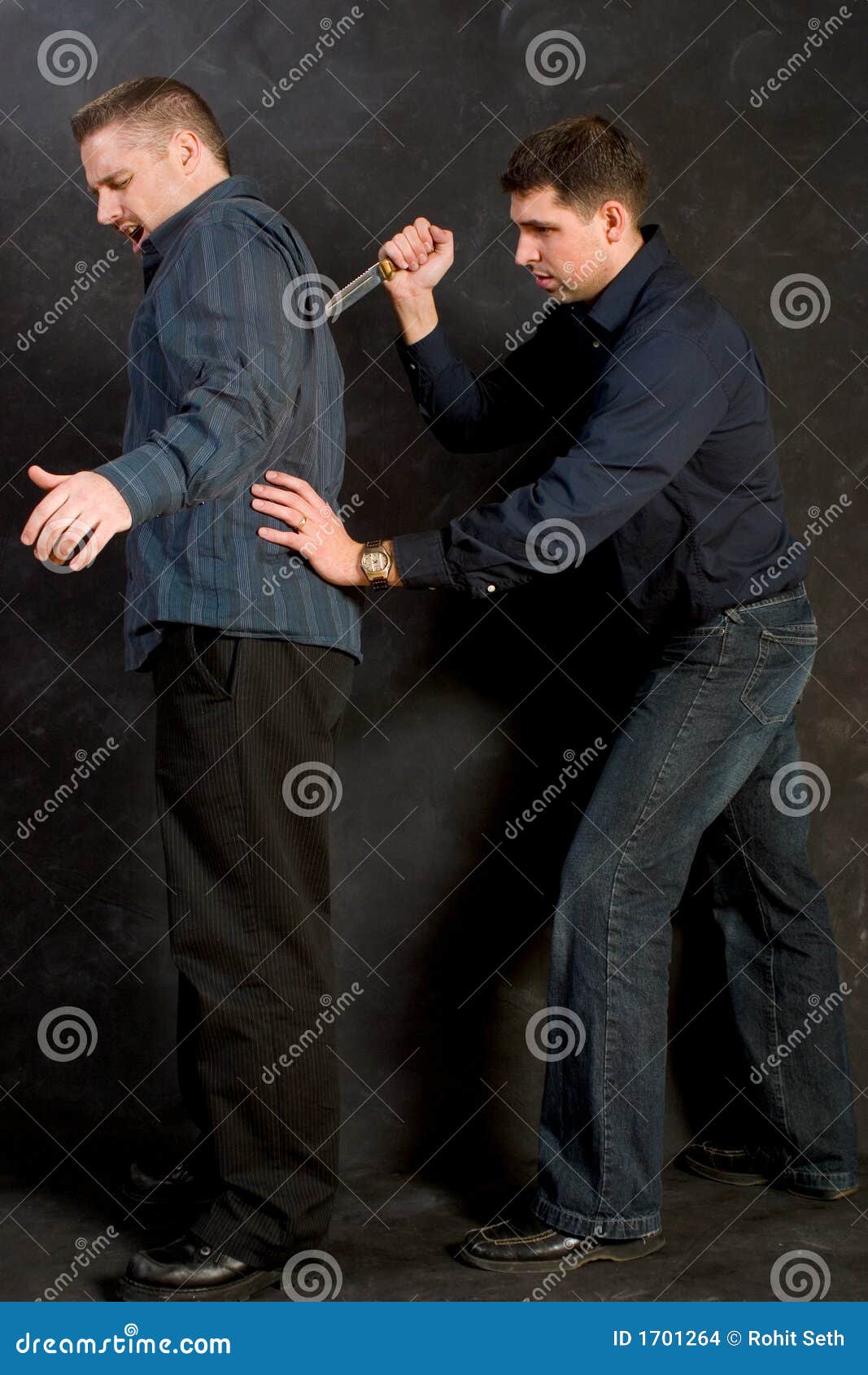 Stab in the back stock photo. Image of bitter, back, annoyed - 1701264